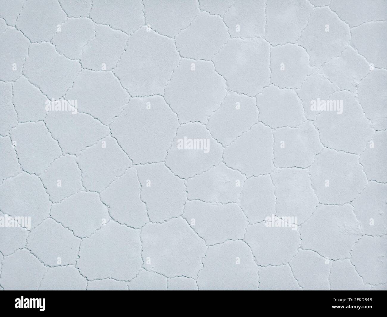 Aerial top down view of hexagonal shaped white salt flat pattern ...