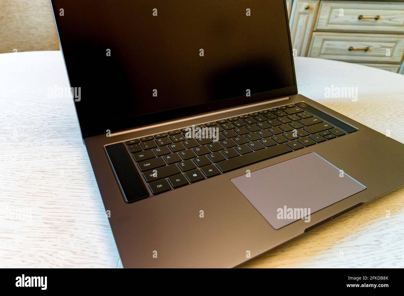 Dark keyboard and laptop touchpad. Technology and business concept ...