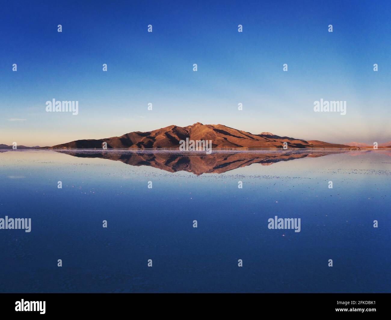 Andes mountains sunrise panorama mirror reflection on Salar de Uyuni ...