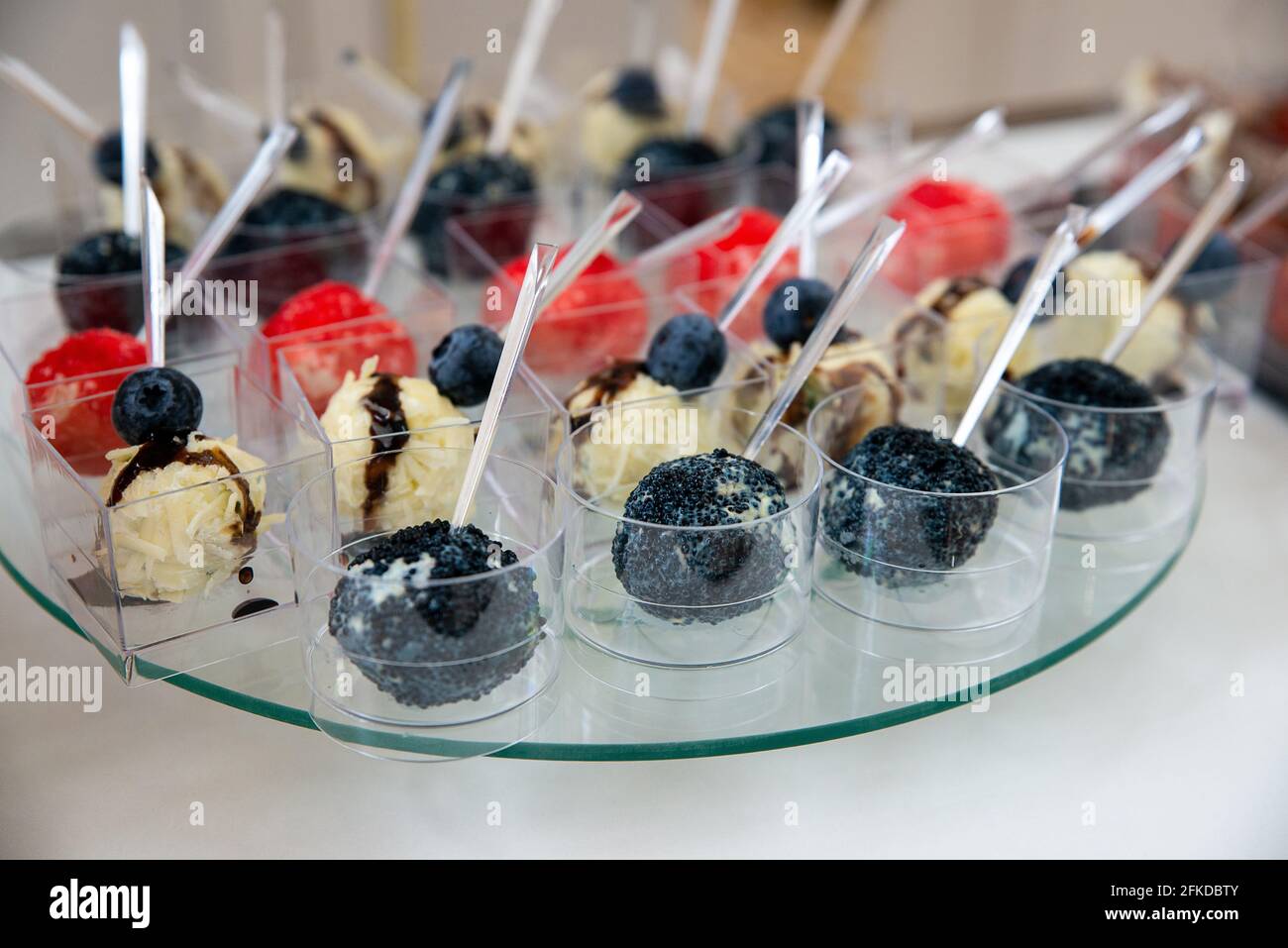 Rows of delicious desserts in beautiful compositions. Sweets on the ...