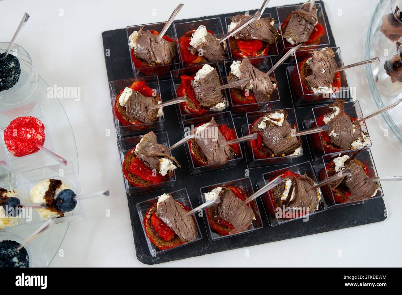 meat rolls at a buffet table. canapes. copyspace Stock Photo - Alamy