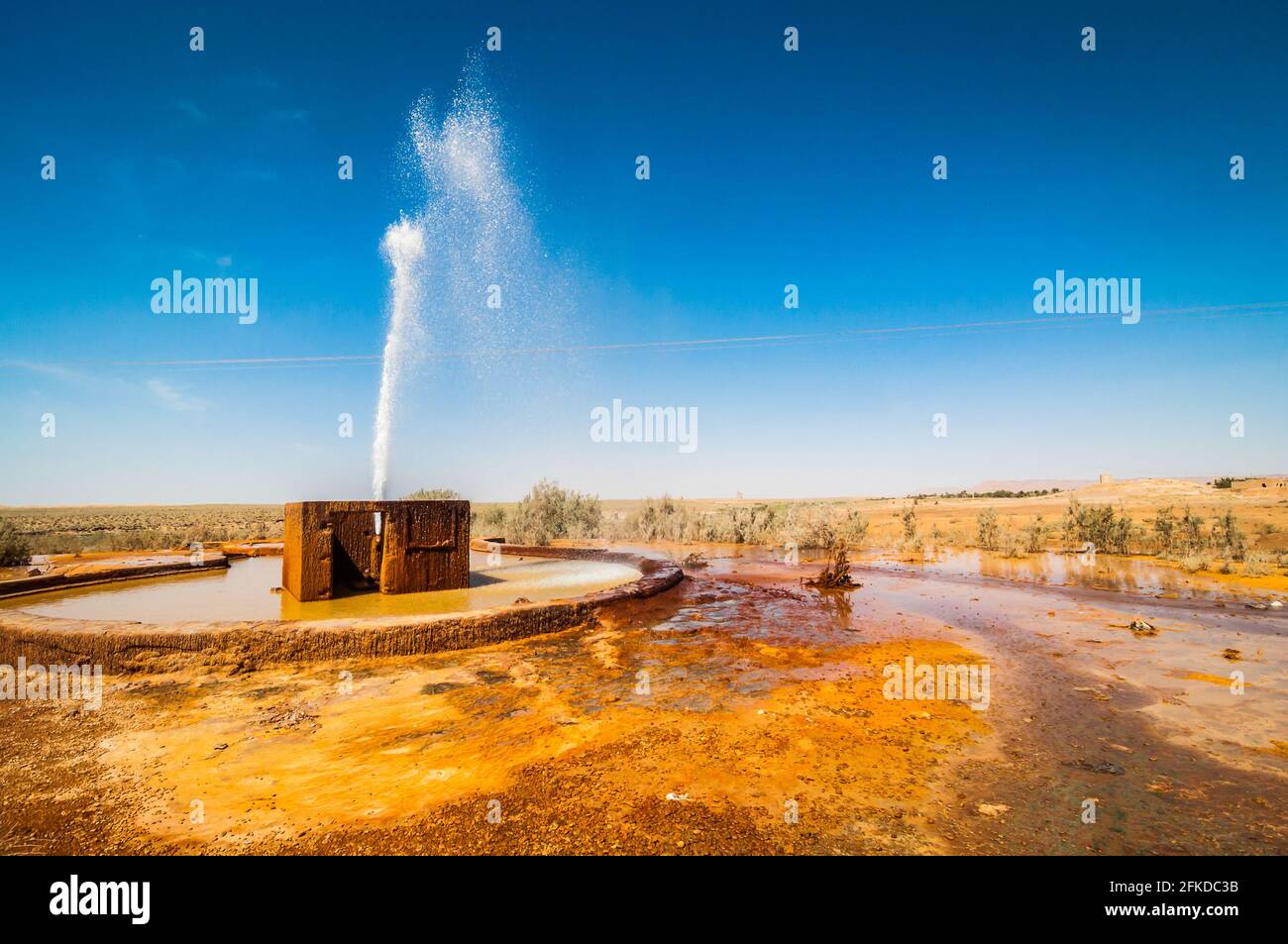 Orange mineral pool of natural water spring in Damia with stream or ...