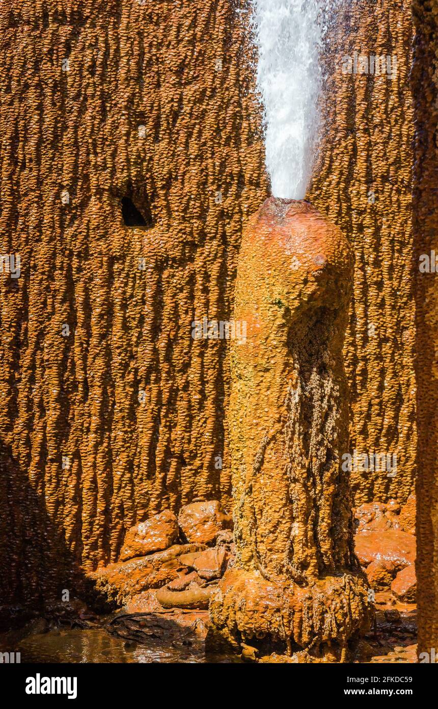 Phallic shape tube with strong stream splashing water to the air in ...