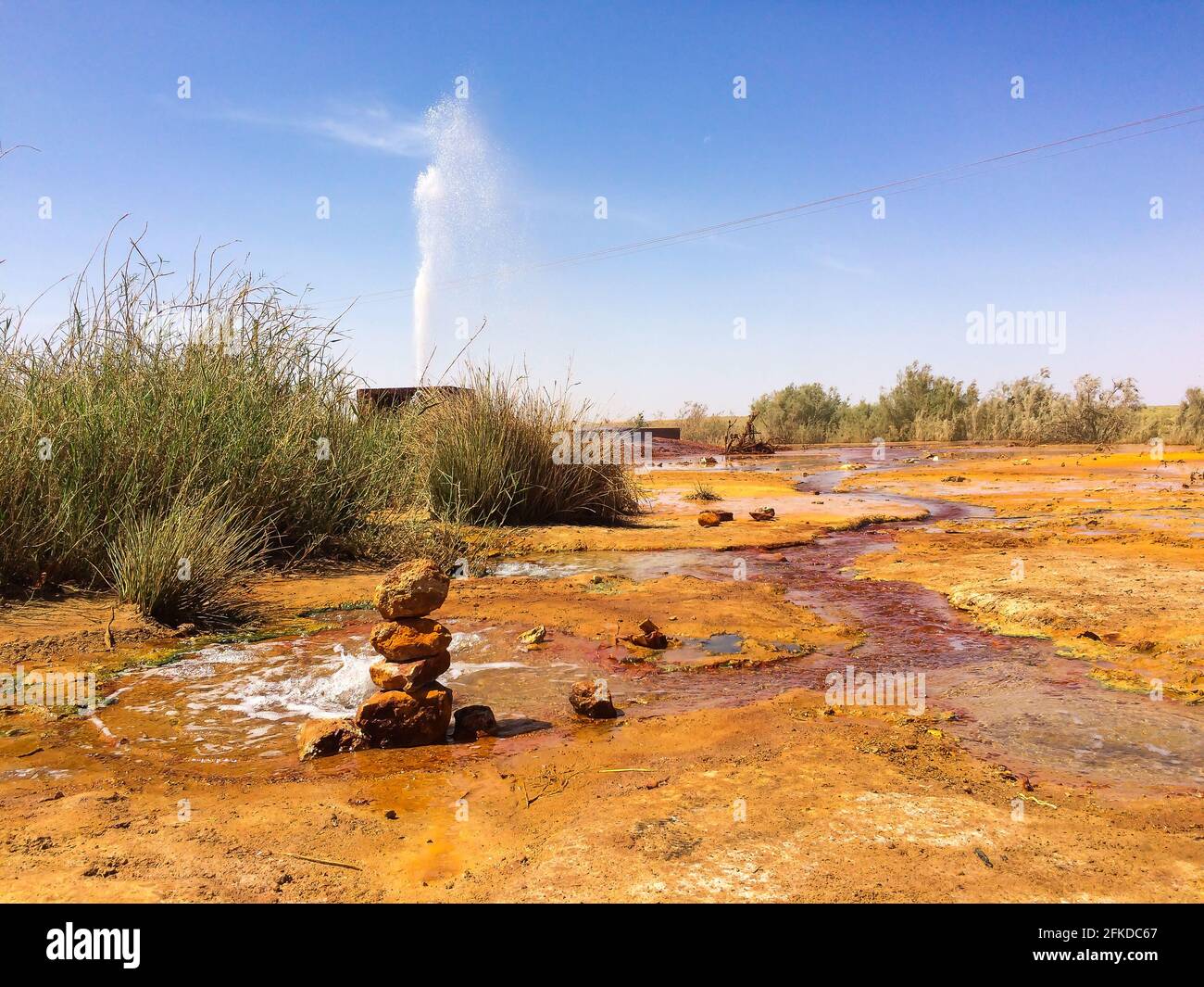 Orange mineral pool of natural water spring in Damia with stream or ...