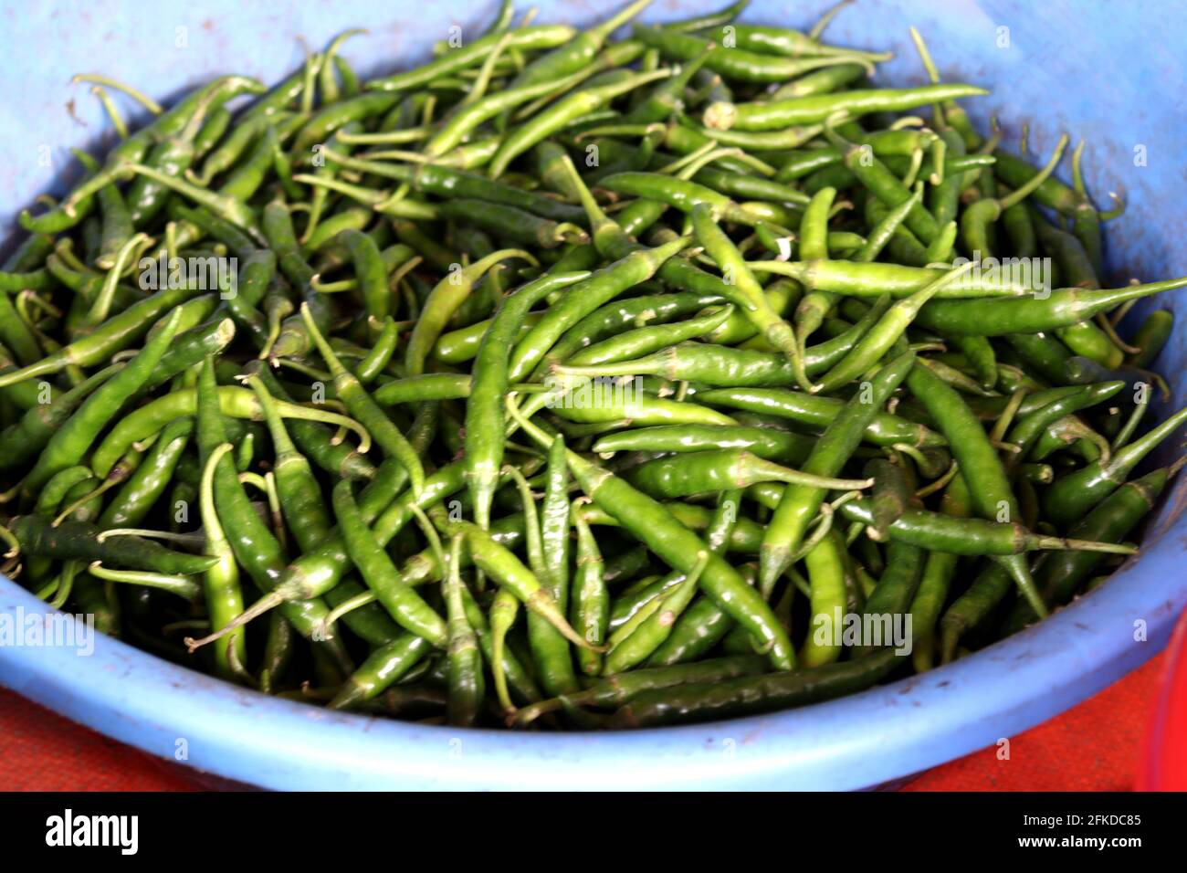 hot and spicy green raw chili stock on shop Stock Photo - Alamy