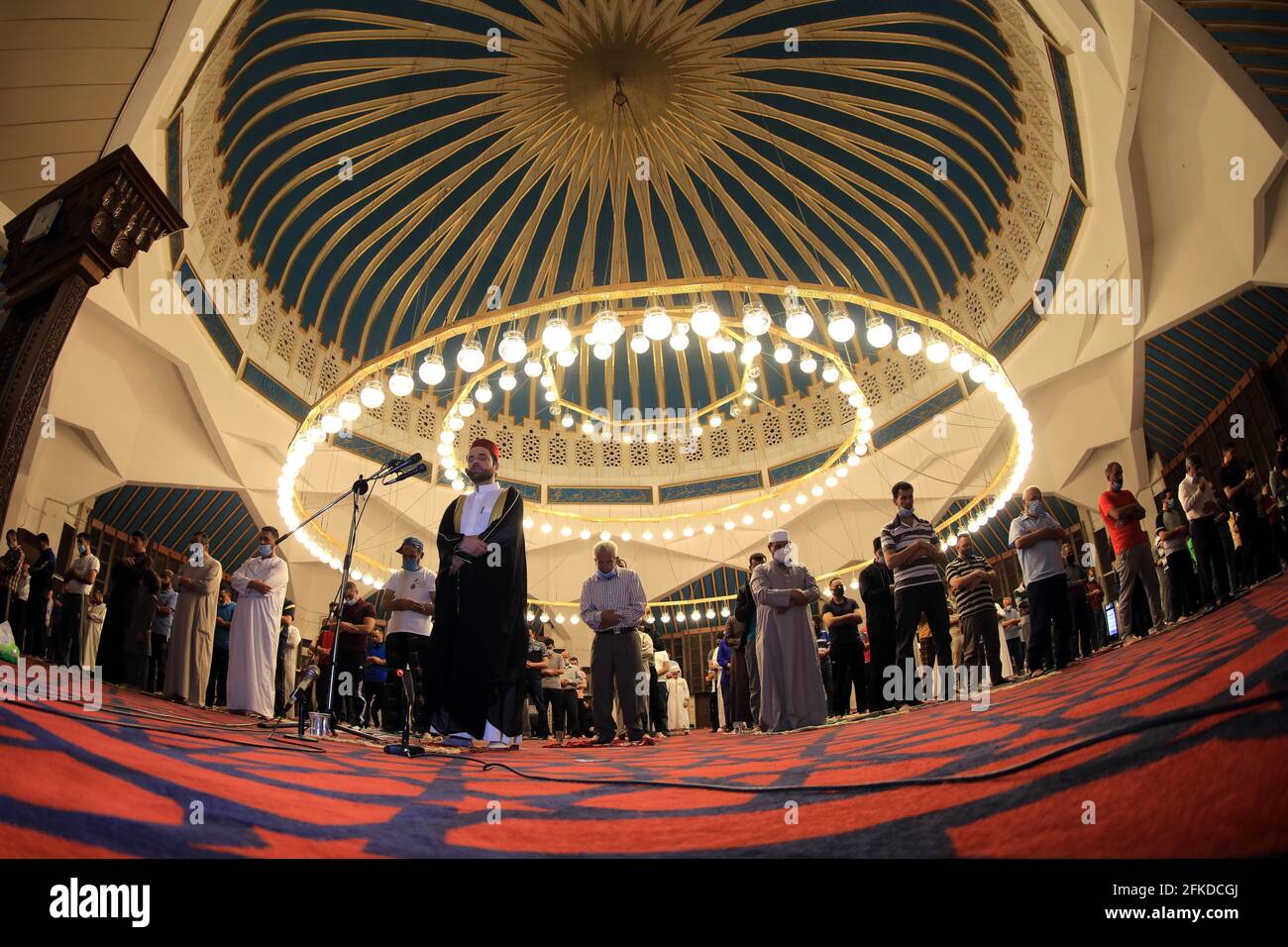 Amman, Jordan. 30th Apr, 2021. Muslims perform prayers during the ...