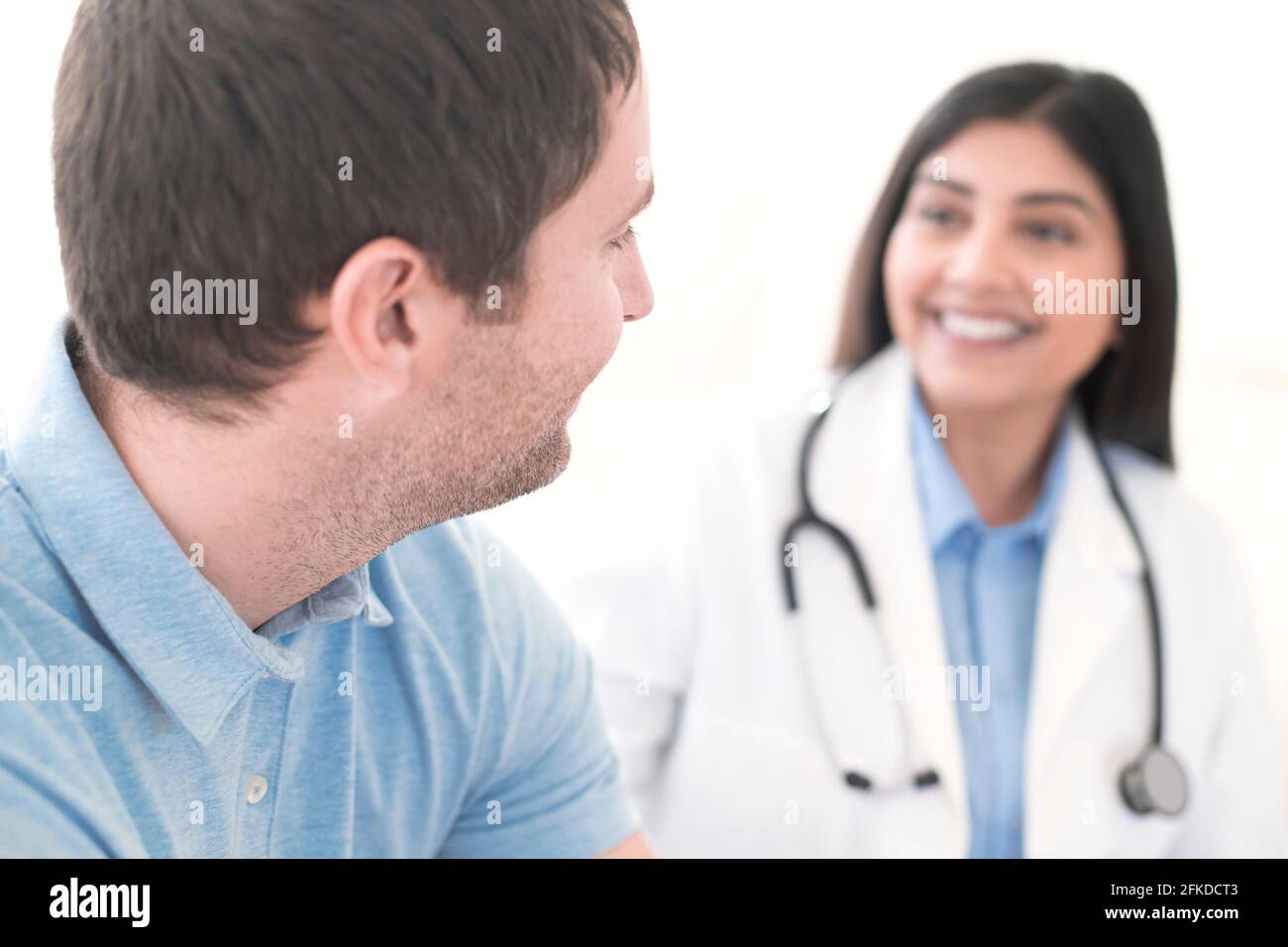 Doctor talking with patient Stock Photo - Alamy