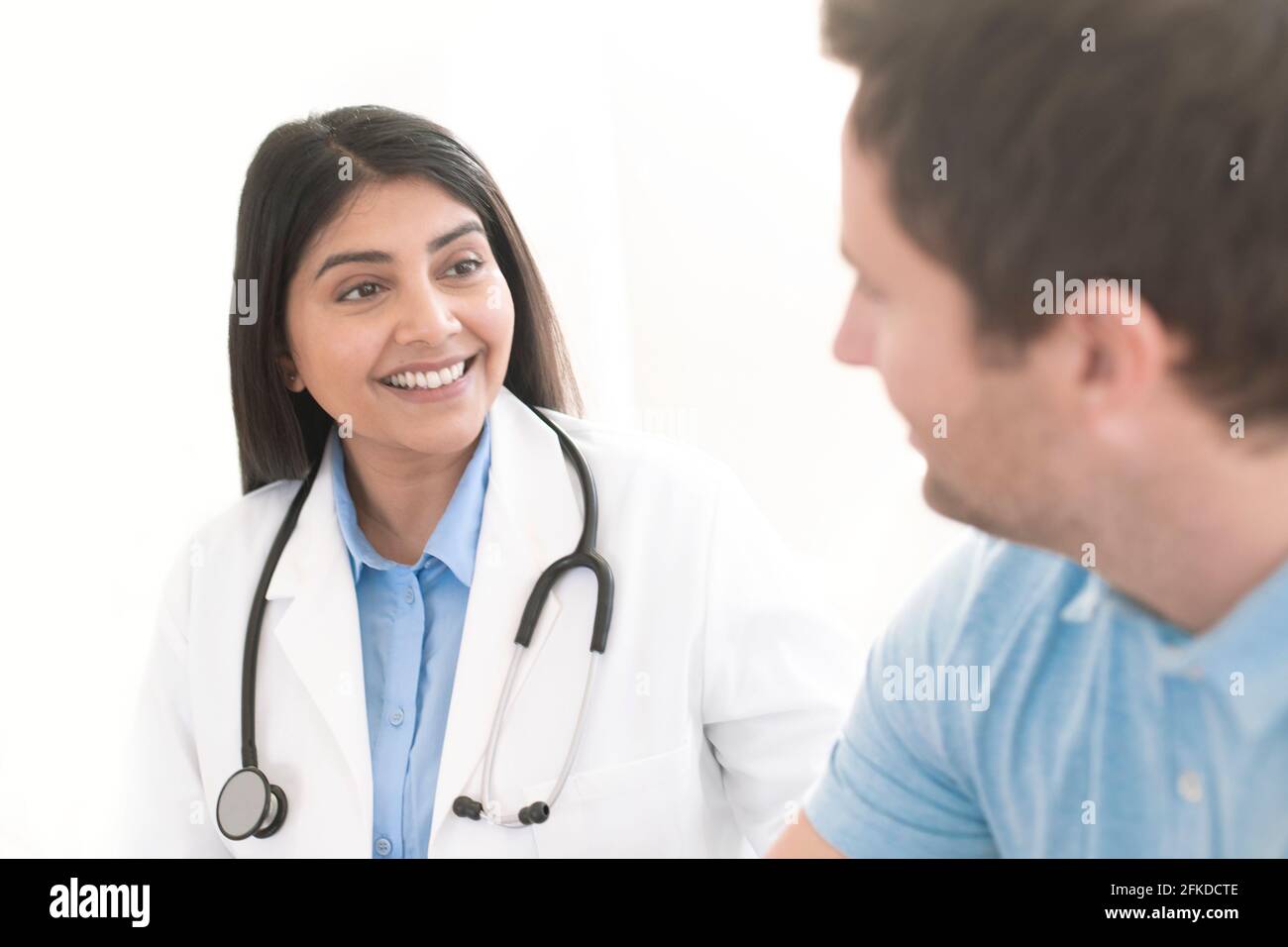 Doctor talking with patient Stock Photo - Alamy