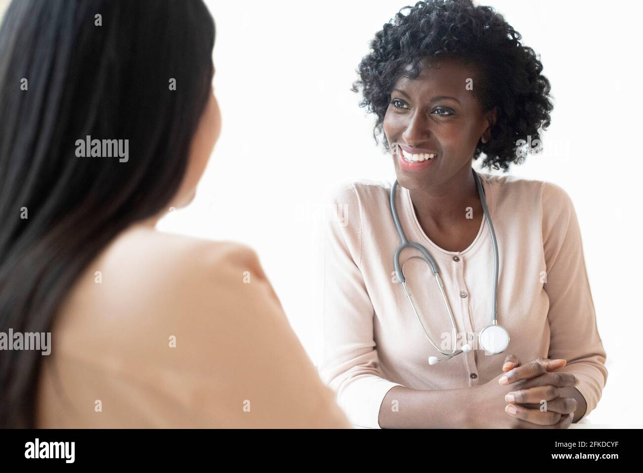 Doctor talking with patient Stock Photo - Alamy