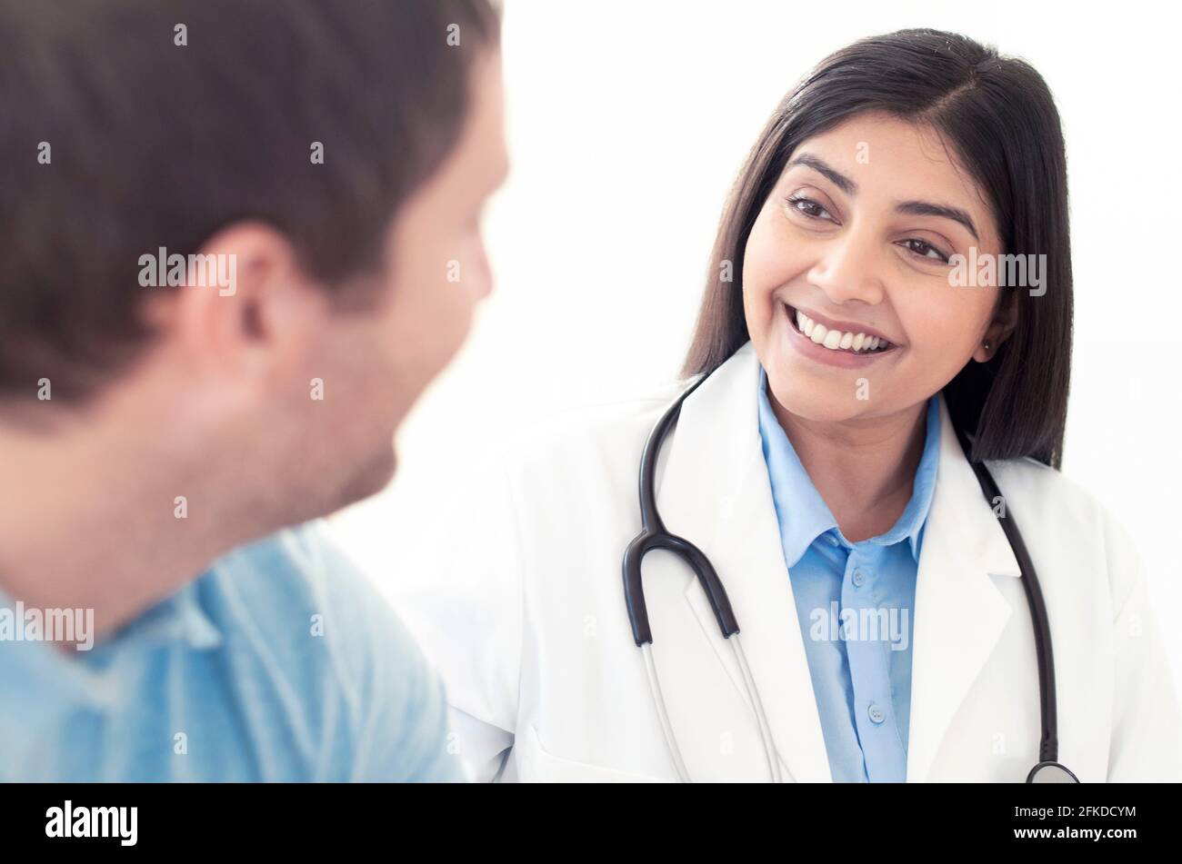 Doctor talking with patient Stock Photo - Alamy