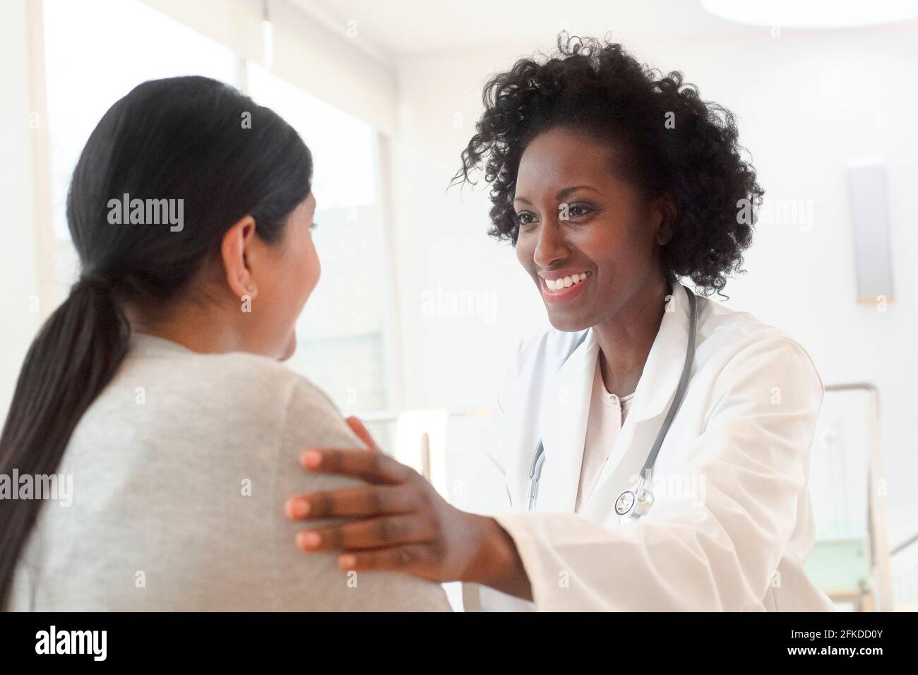 Doctor talking with patient Stock Photo - Alamy