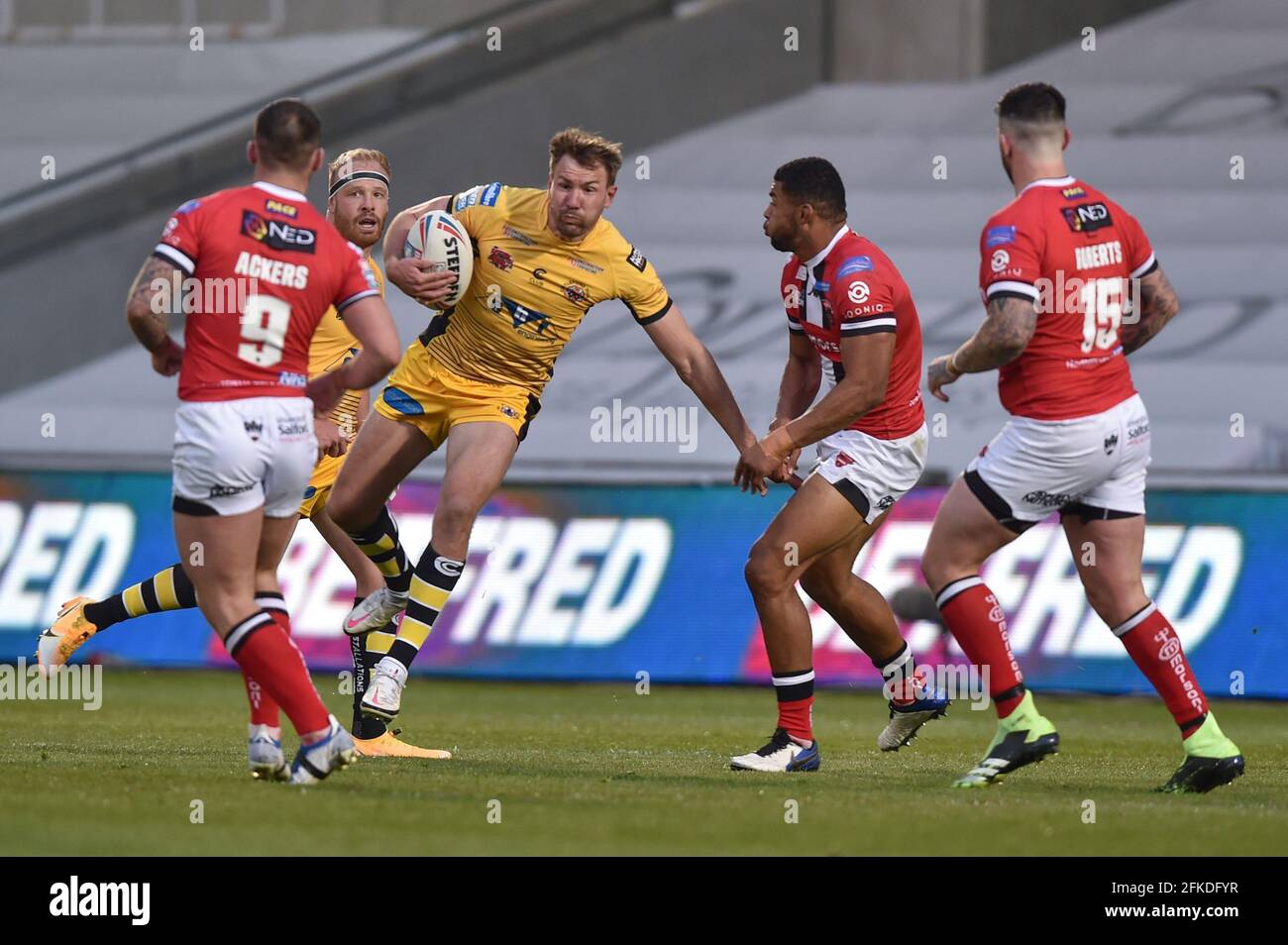 Michael Shenton (4) of Castleford Tigers evades the Salford defence ...