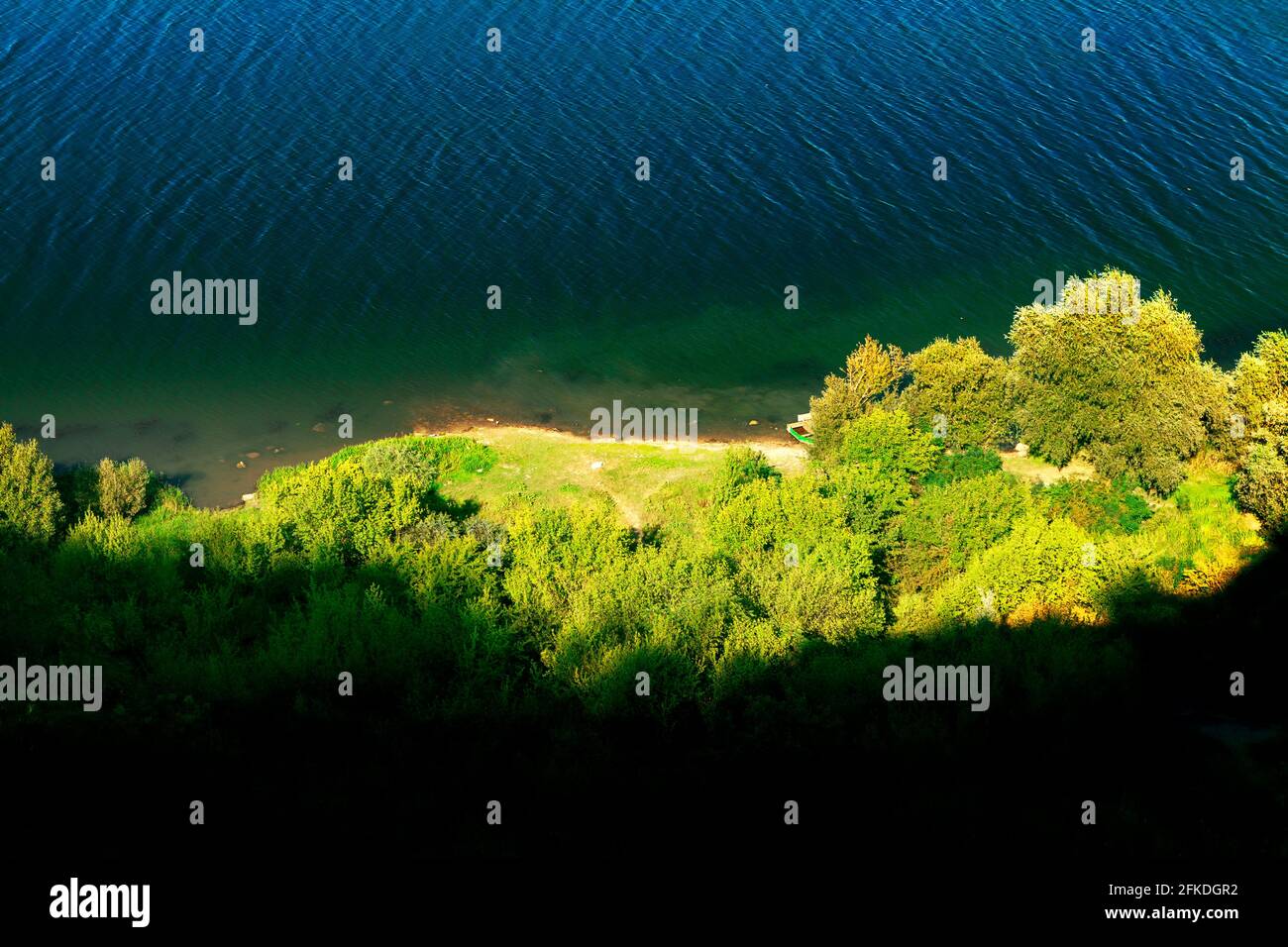 Rainforest at the riverside . Aerial view of green nature and flowing ...