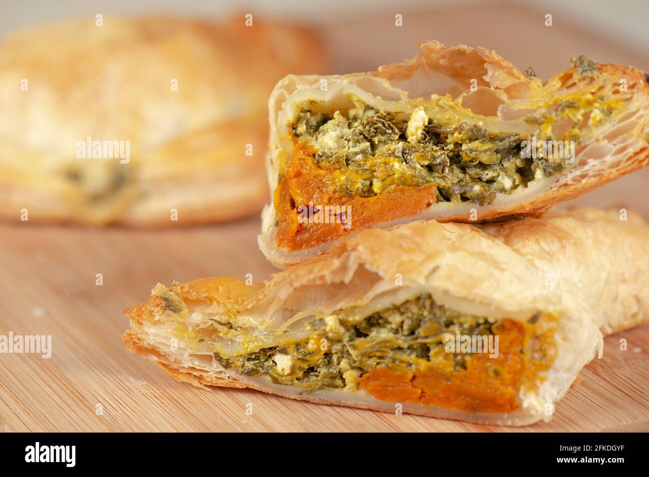 Freshly baked spinach triangle pastry with danish feta and roaster ...