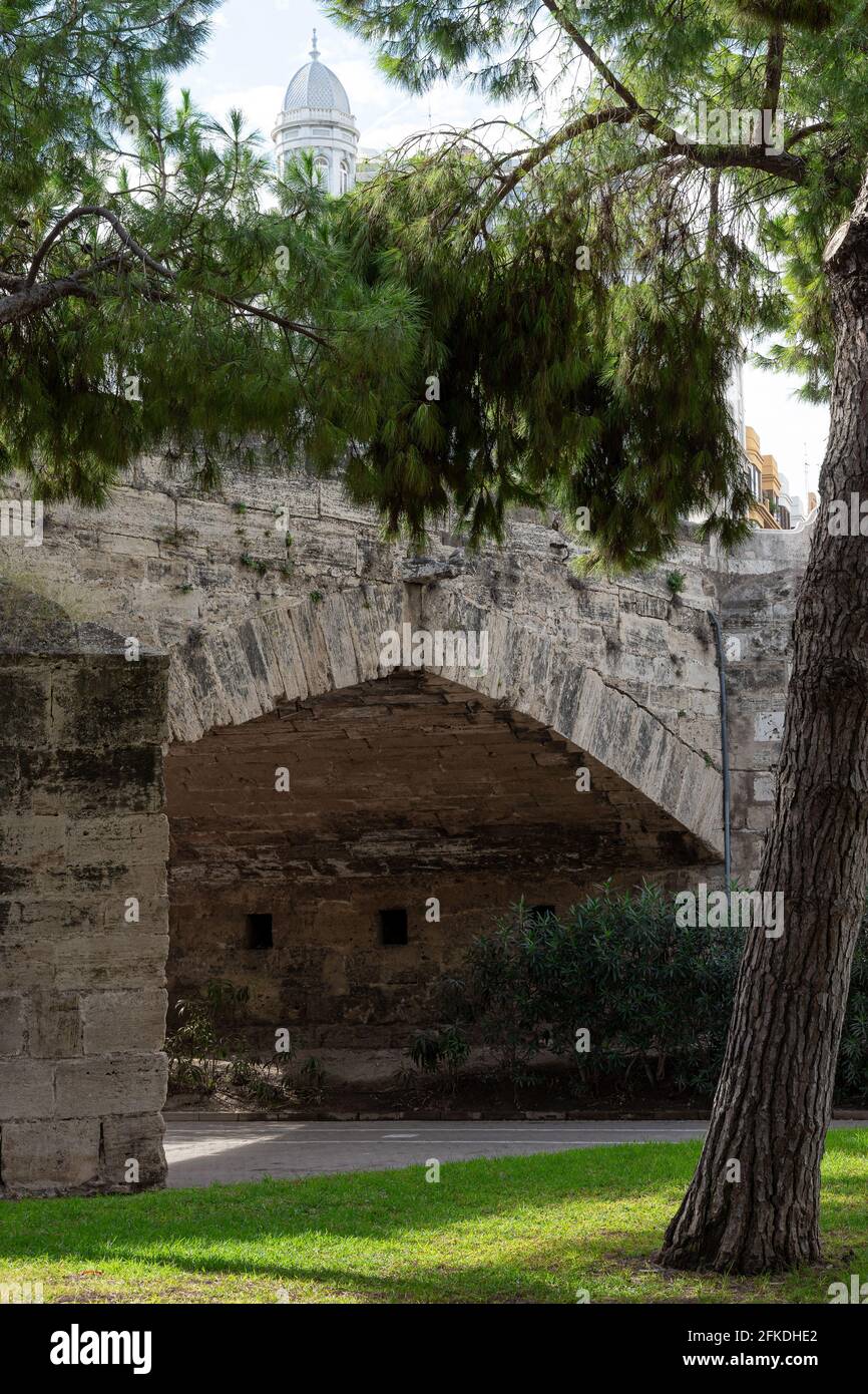 Ancient stone bridge across old river bed. Puente del Mar, Turia river ...
