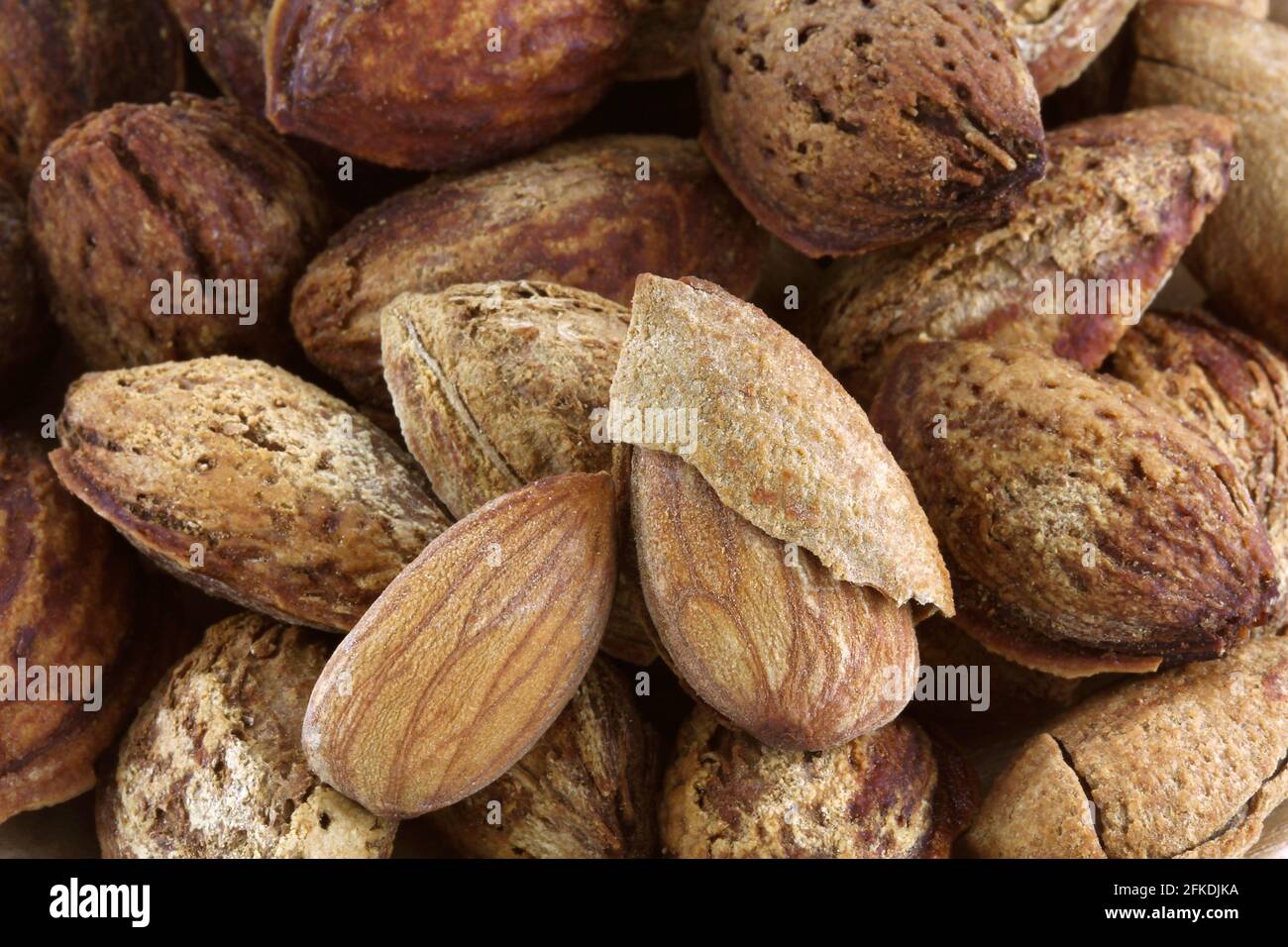 Shelled and unshelled almonds isolated on white background Stock Photo ...
