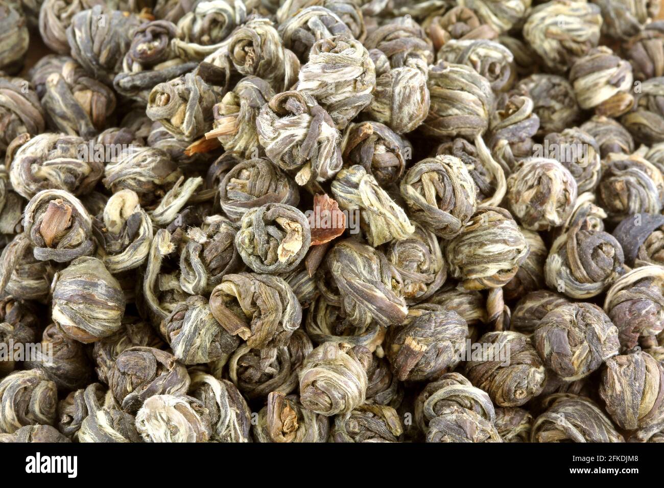 Background photo of dried Chinese hand rolled green tea leaves Stock ...