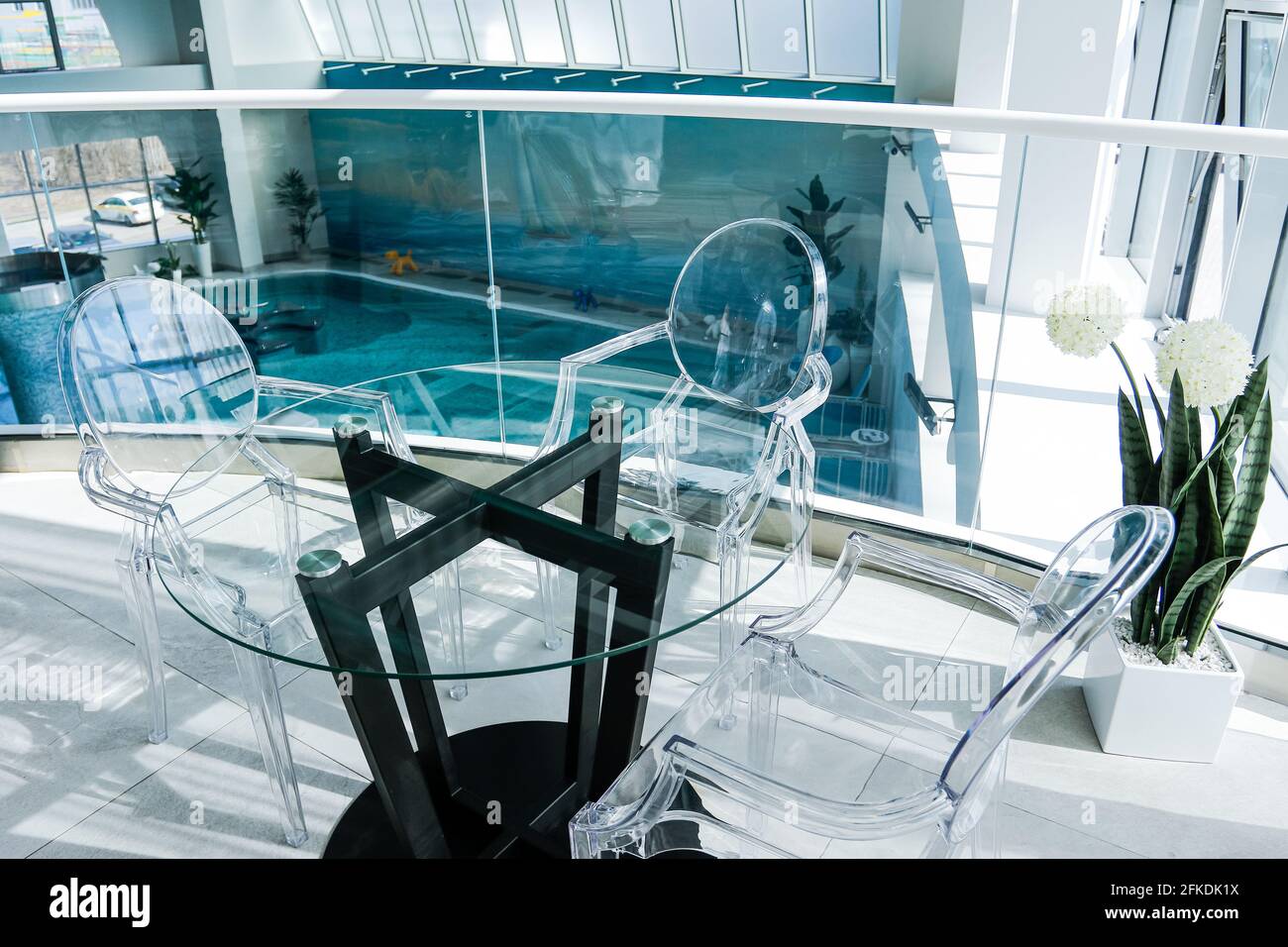 Designer transparent table and chairs in the spa center against the ...