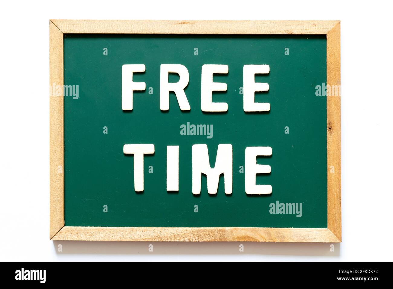 Green blackboard and wood frame with word free time on white background ...