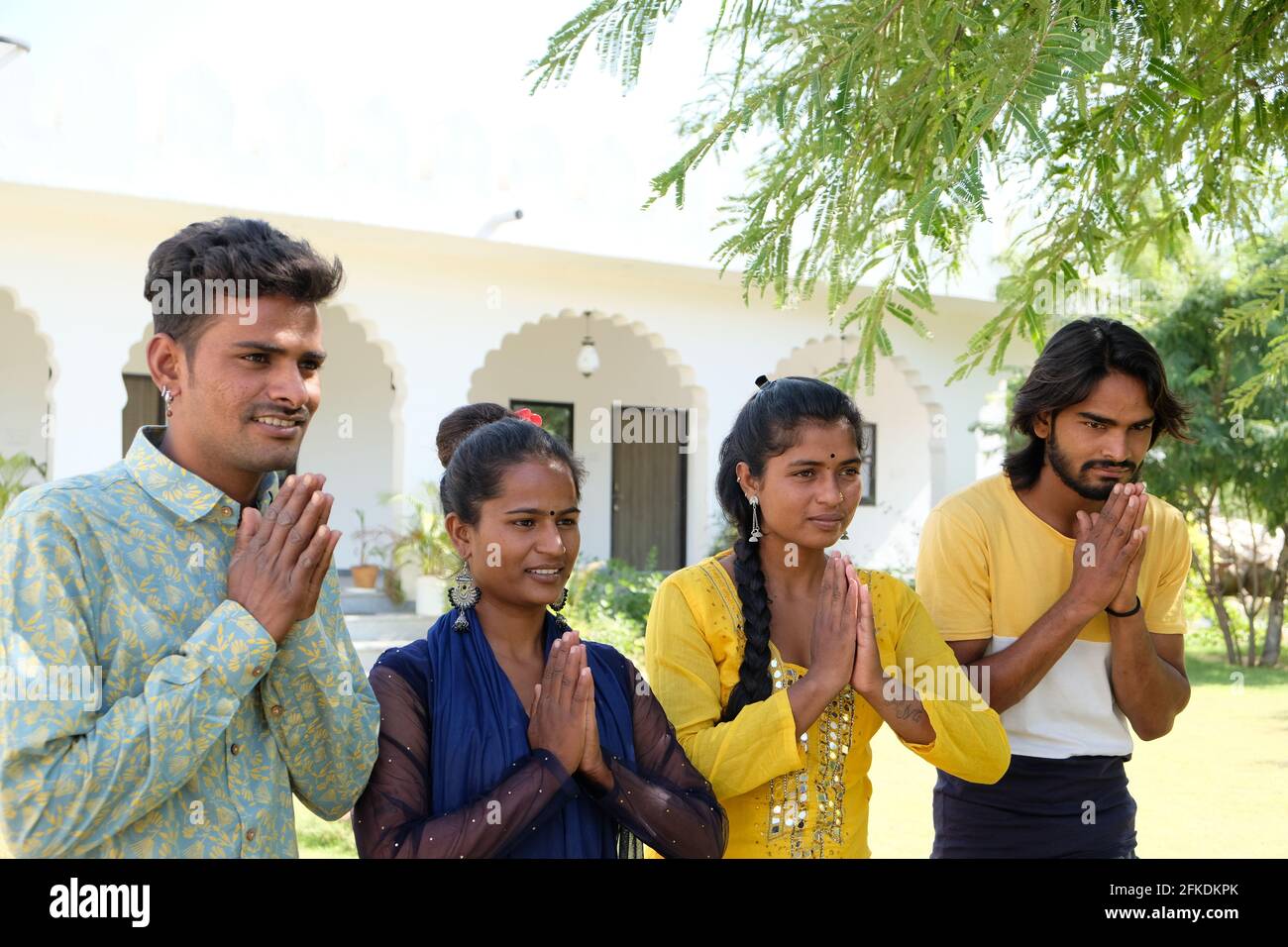Group of young Indian friends standing outdoors doing namaste Stock ...