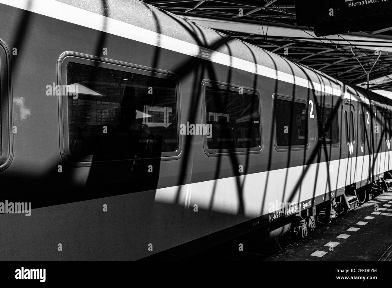 Closeup of structure shadows cast on a metro train in grayscale Stock ...