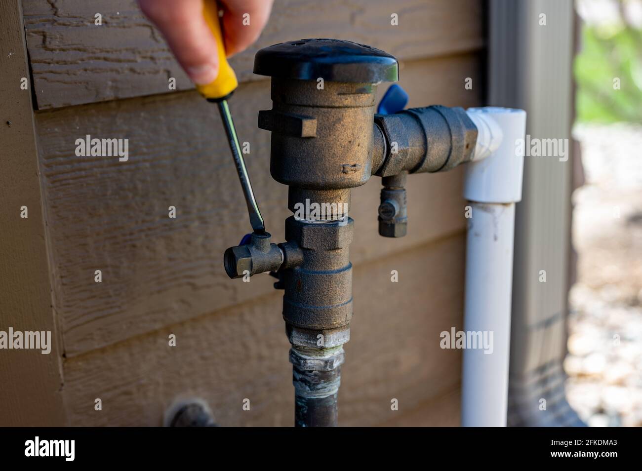Preparing to start up a sprinkler irrigation system in the spring by ...