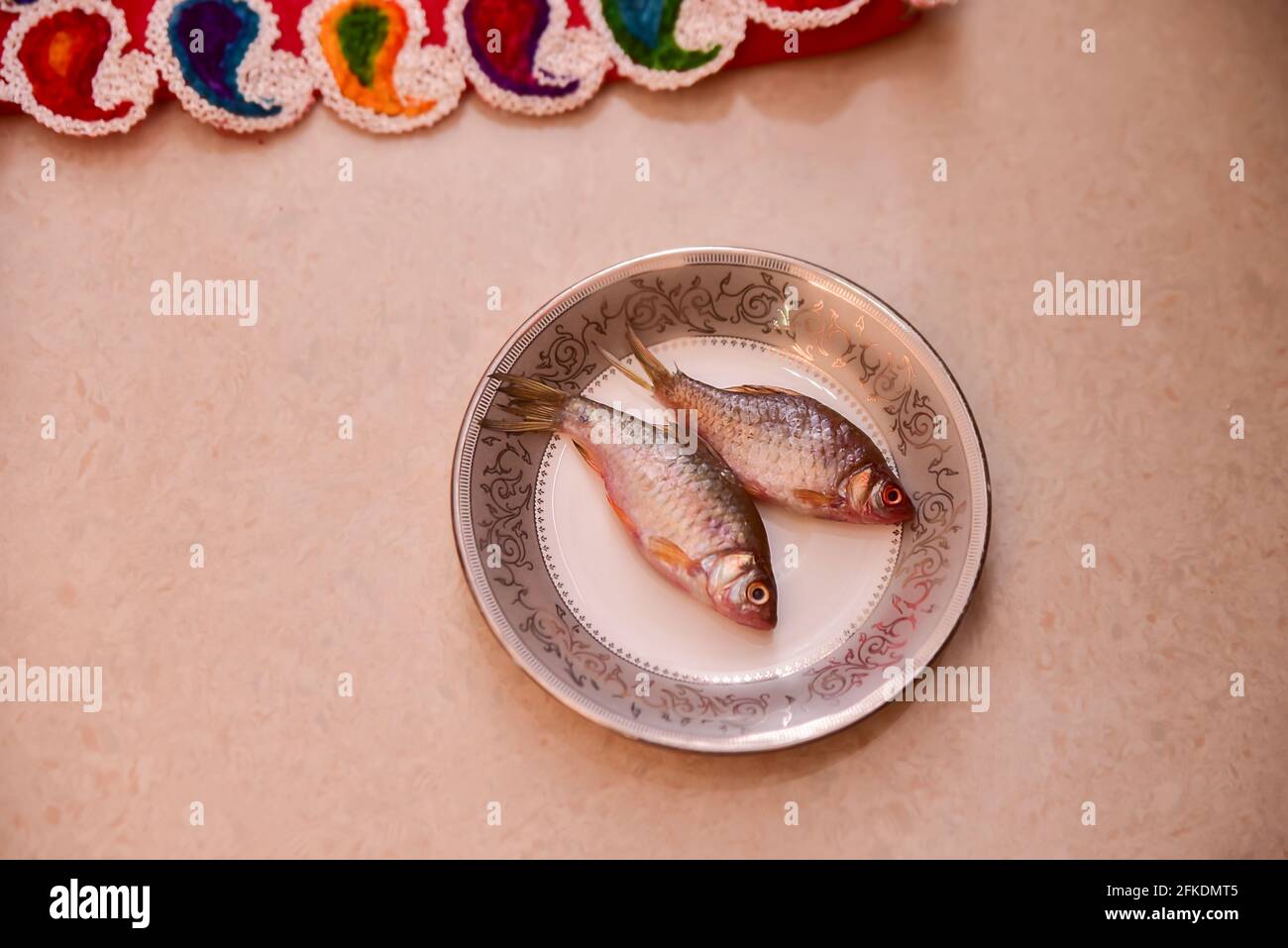 Top view of two fish on the plate for Bengali wedding rituals Stock ...