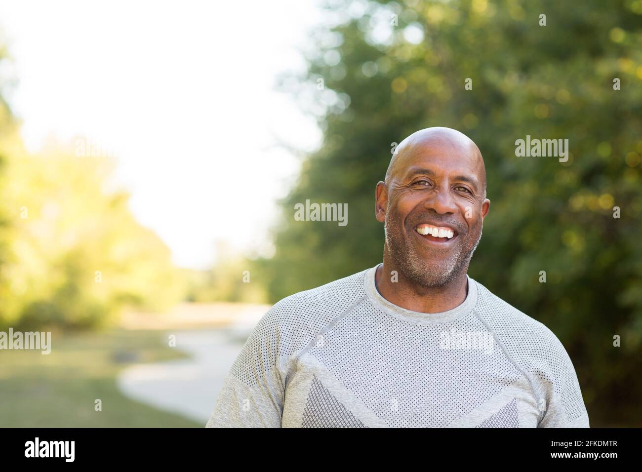 Mature African American man taking a walk outside Stock Photo - Alamy