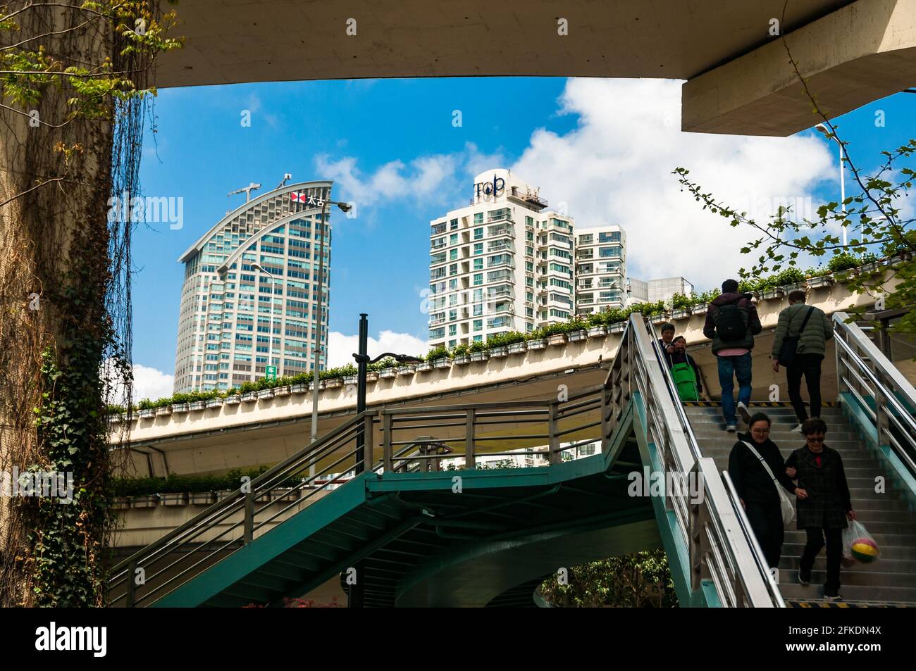 Stairs up to the pedestrian bridge about Yan’an East Road in central ...