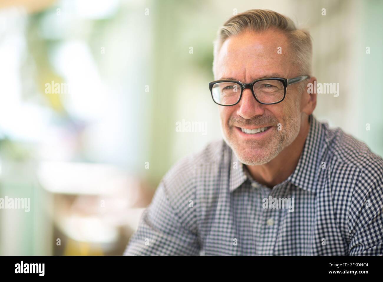 Mature handome fit man sitting outside stock photo Stock Photo - Alamy