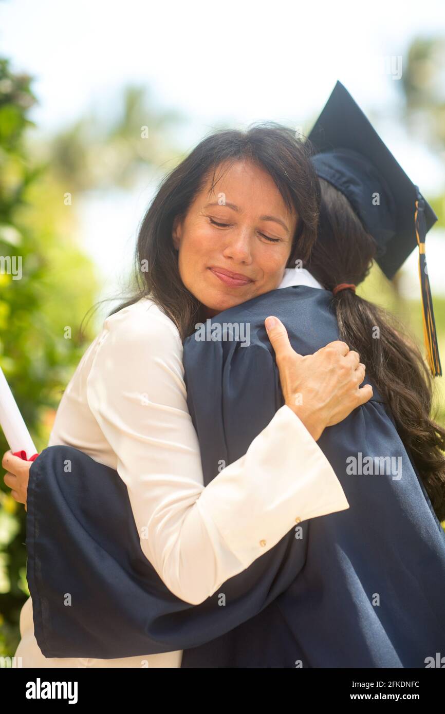 Mother hugging her daugher at her graduation Stock Photo - Alamy