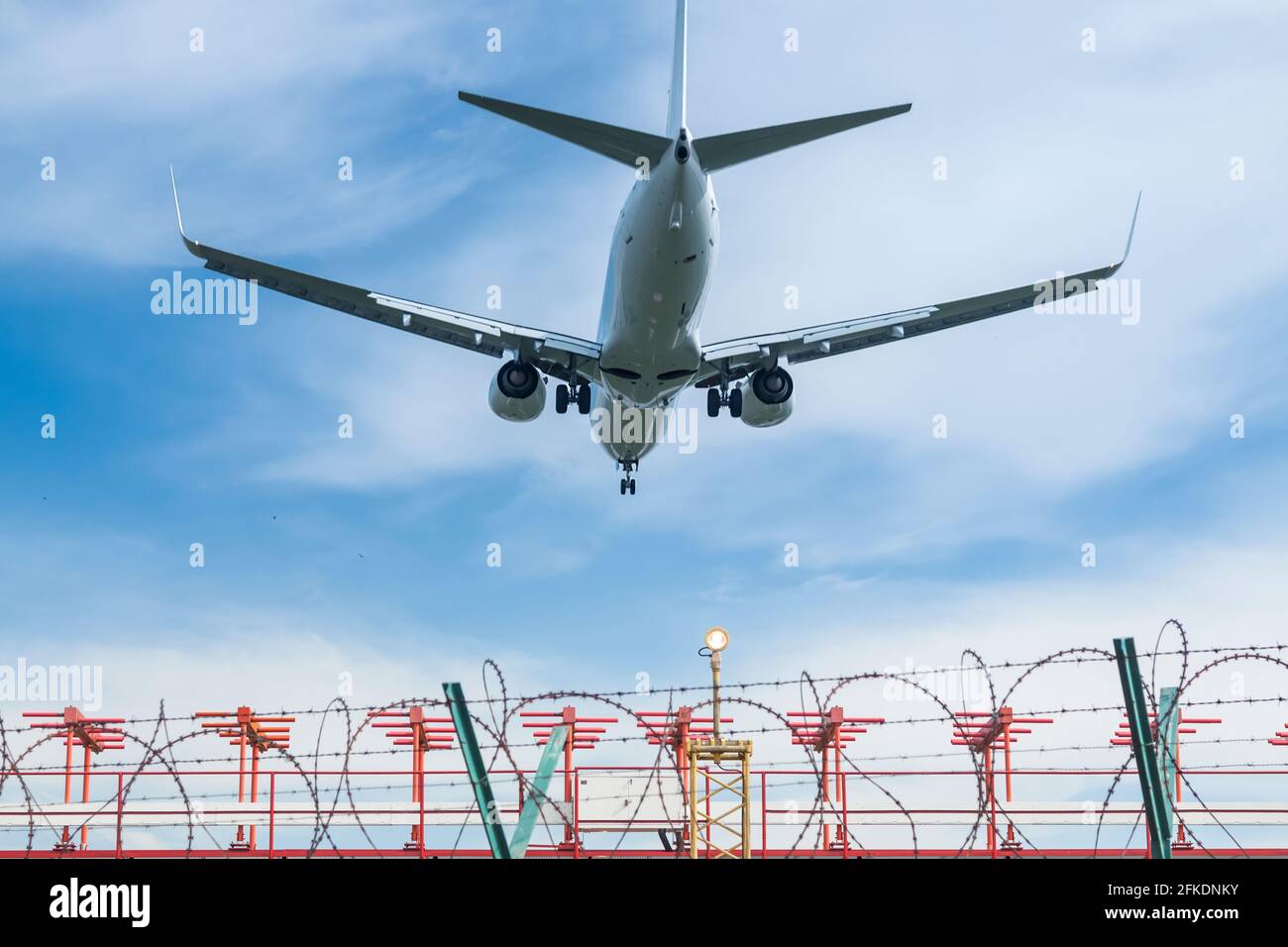 Commercial Jet Aircraft Landing, gear down, overcast sky, approach ...