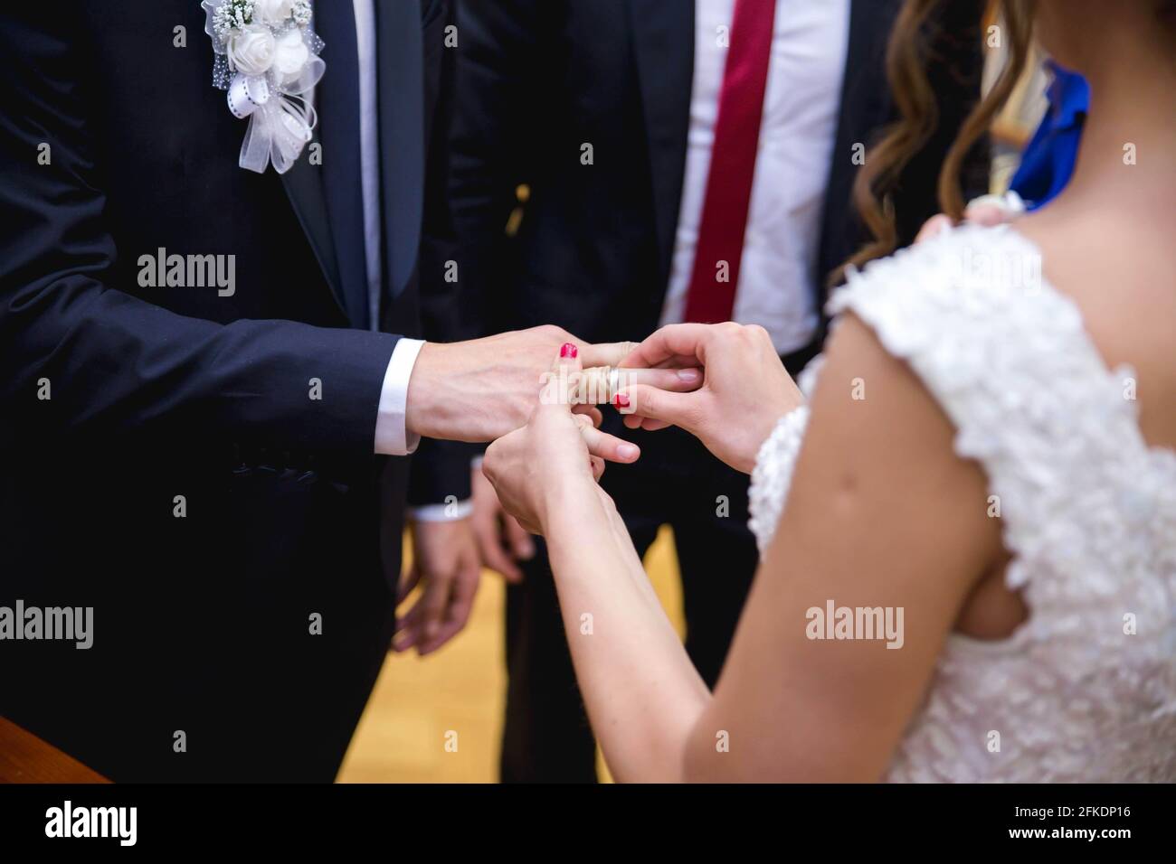 Bride putting a ring on the groom during the wedding ceremony Stock ...