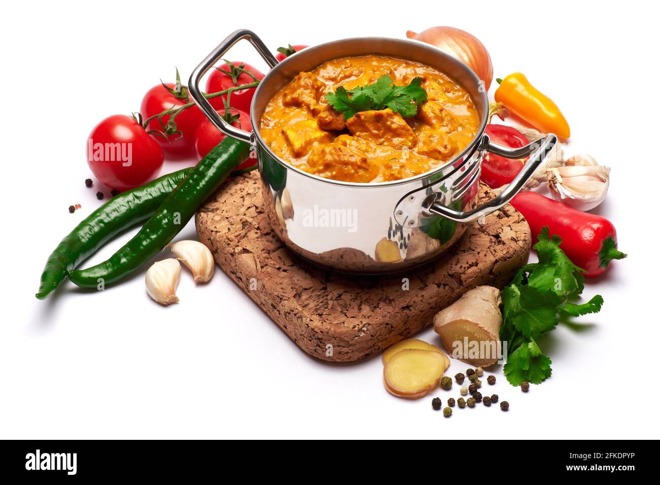 Pot of Traditional Chicken Curry and set of spices on white background ...