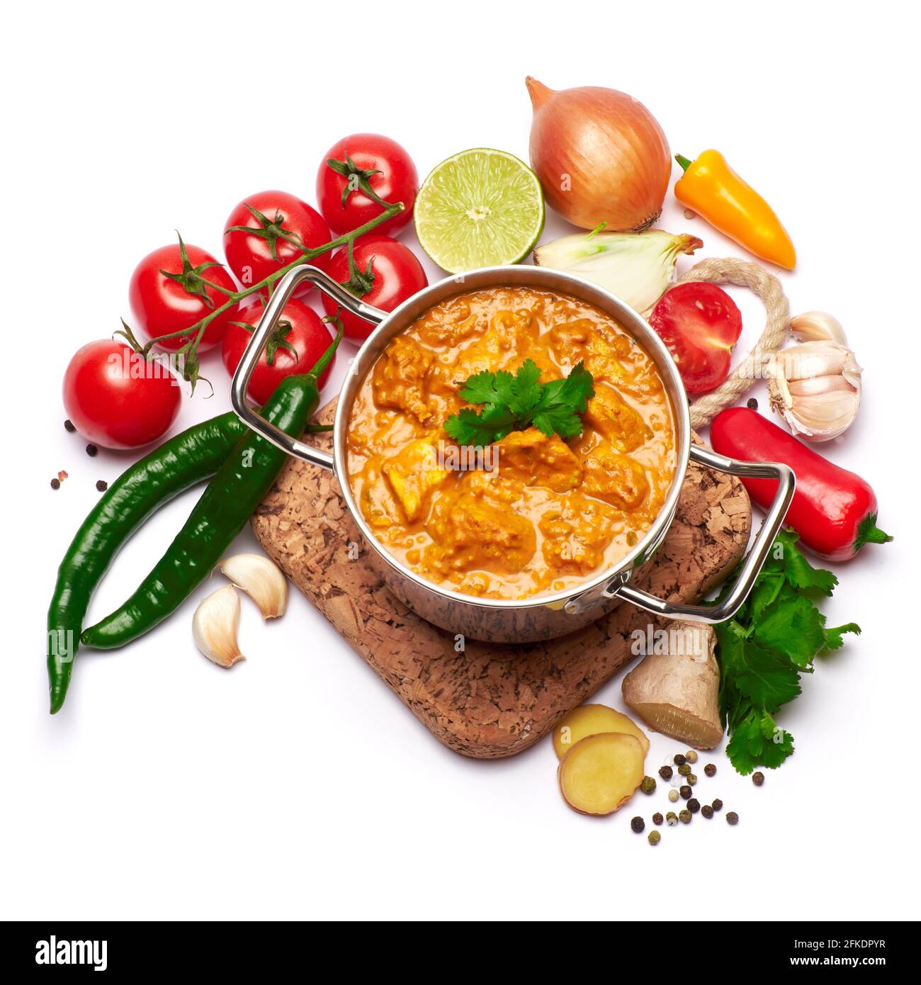 Pot of Traditional Chicken Curry and set of spices on white background ...