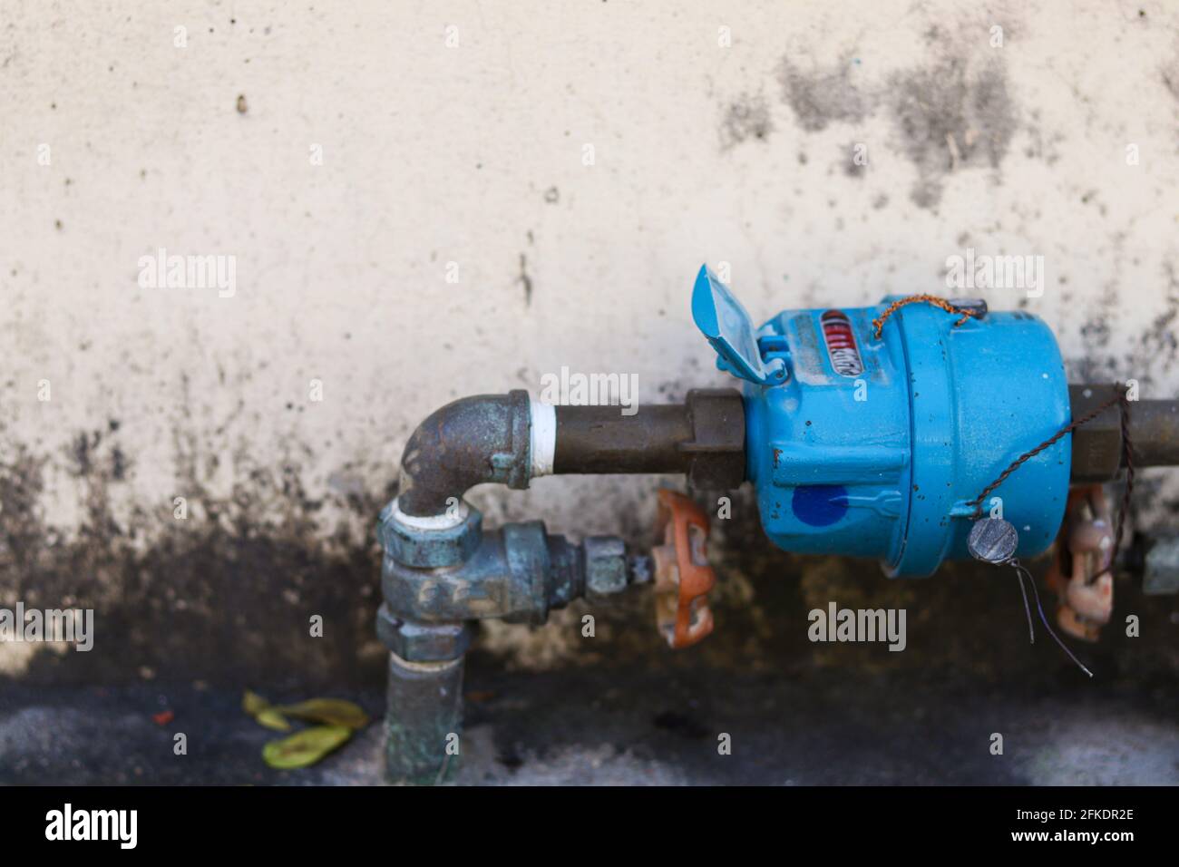 close up Blue Water meter with concrete background, Space for text ...