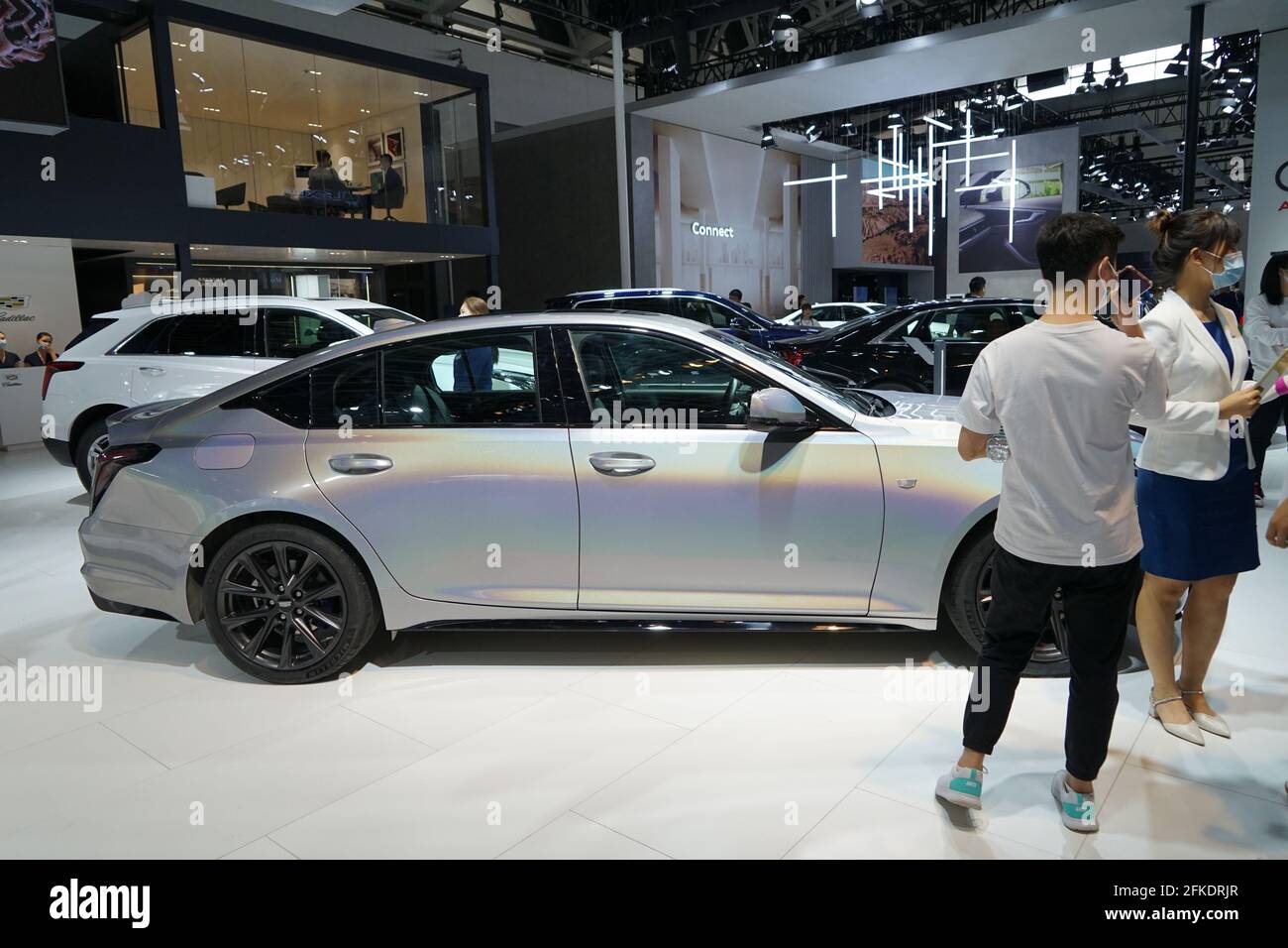 XI'AN, CHINA - APRIL 30, 2021 - Visitors look at new cars at the Xi 'an ...