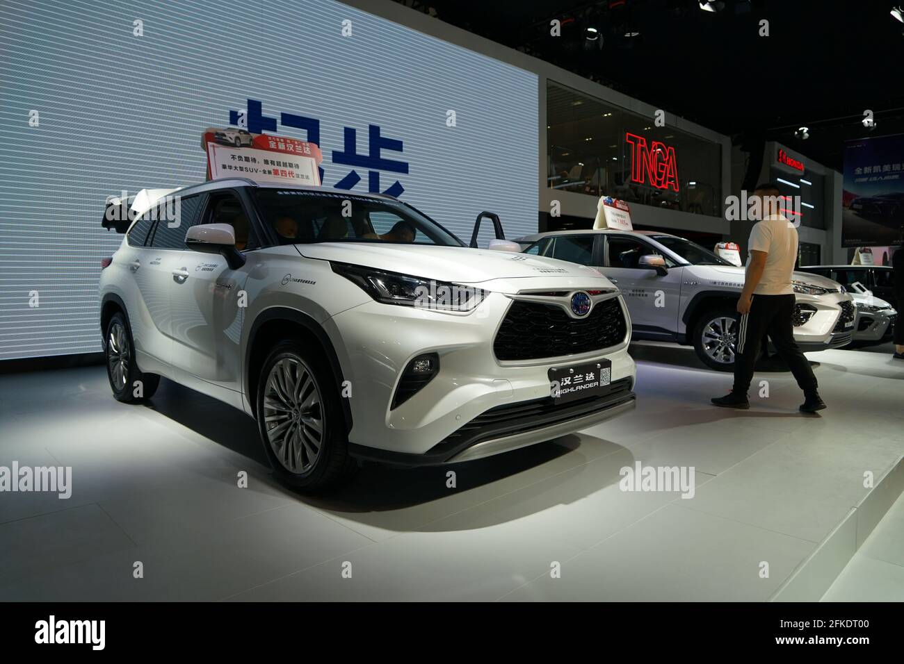 XI'AN, CHINA - APRIL 30, 2021 - Visitors look at new cars at the Xi 'an ...