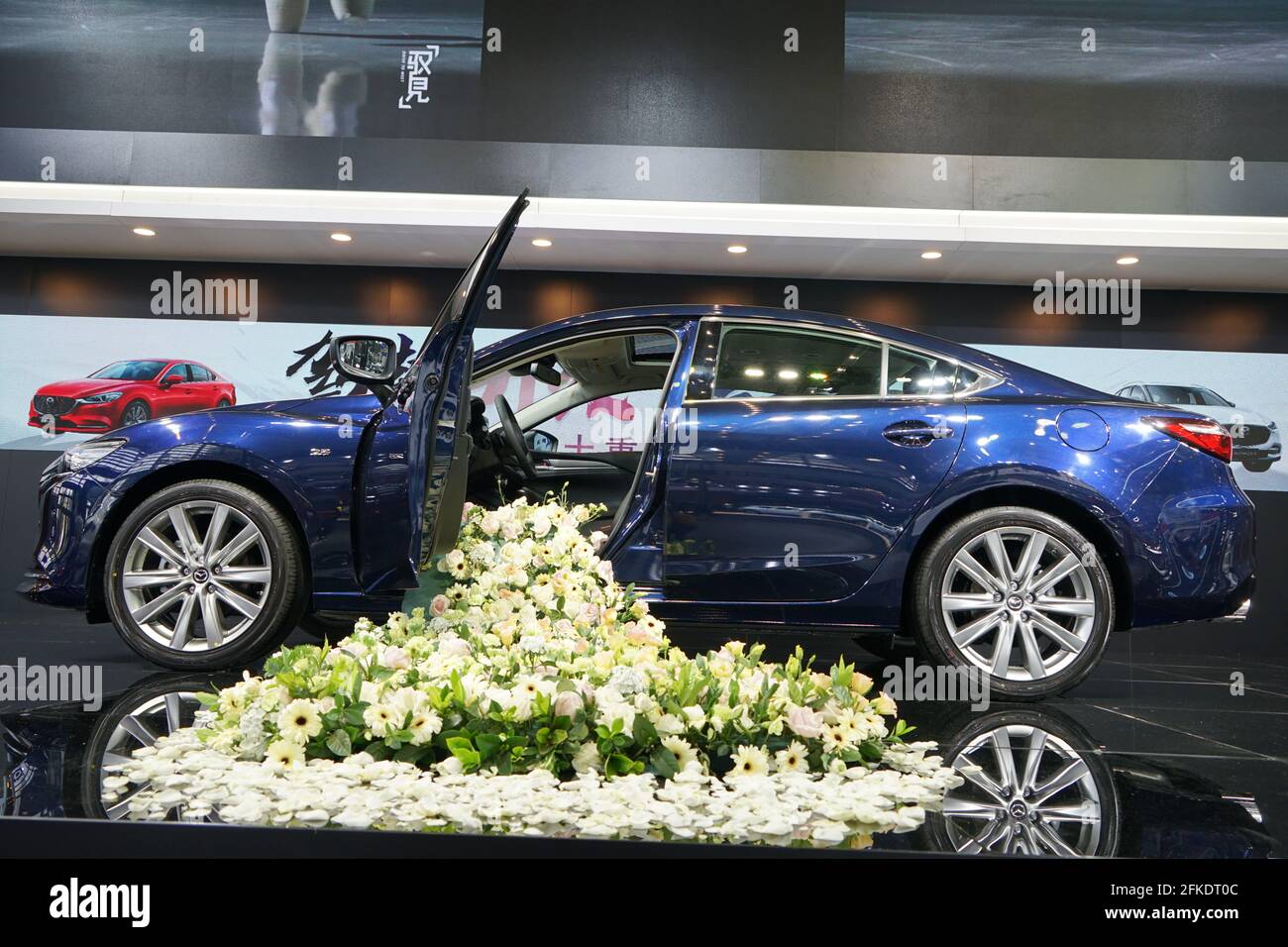 XI'AN, CHINA - APRIL 30, 2021 - Visitors look at new cars at the Xi 'an ...