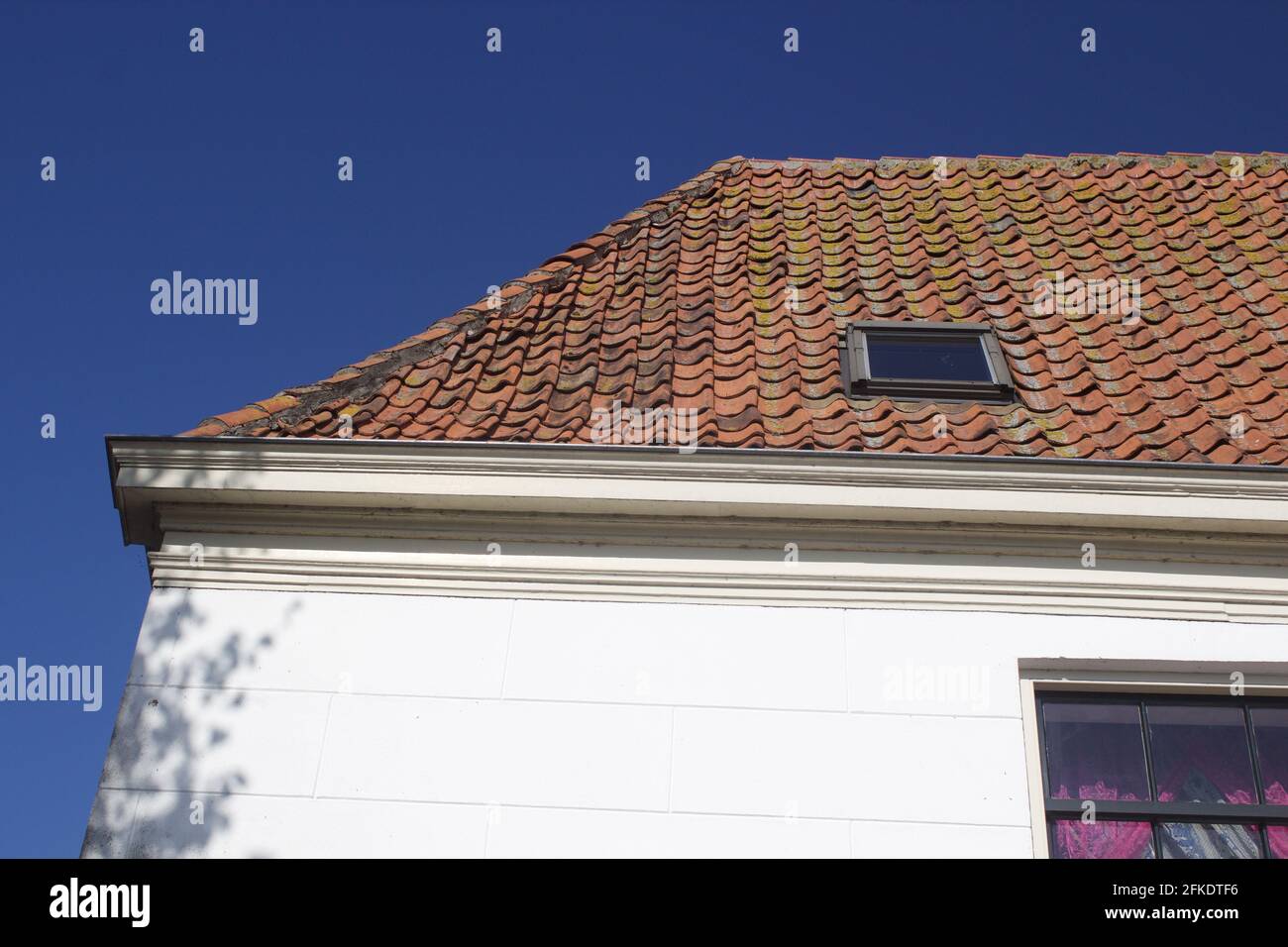 Low angle shot of a gable house under a blue sky in Holland Stock Photo ...