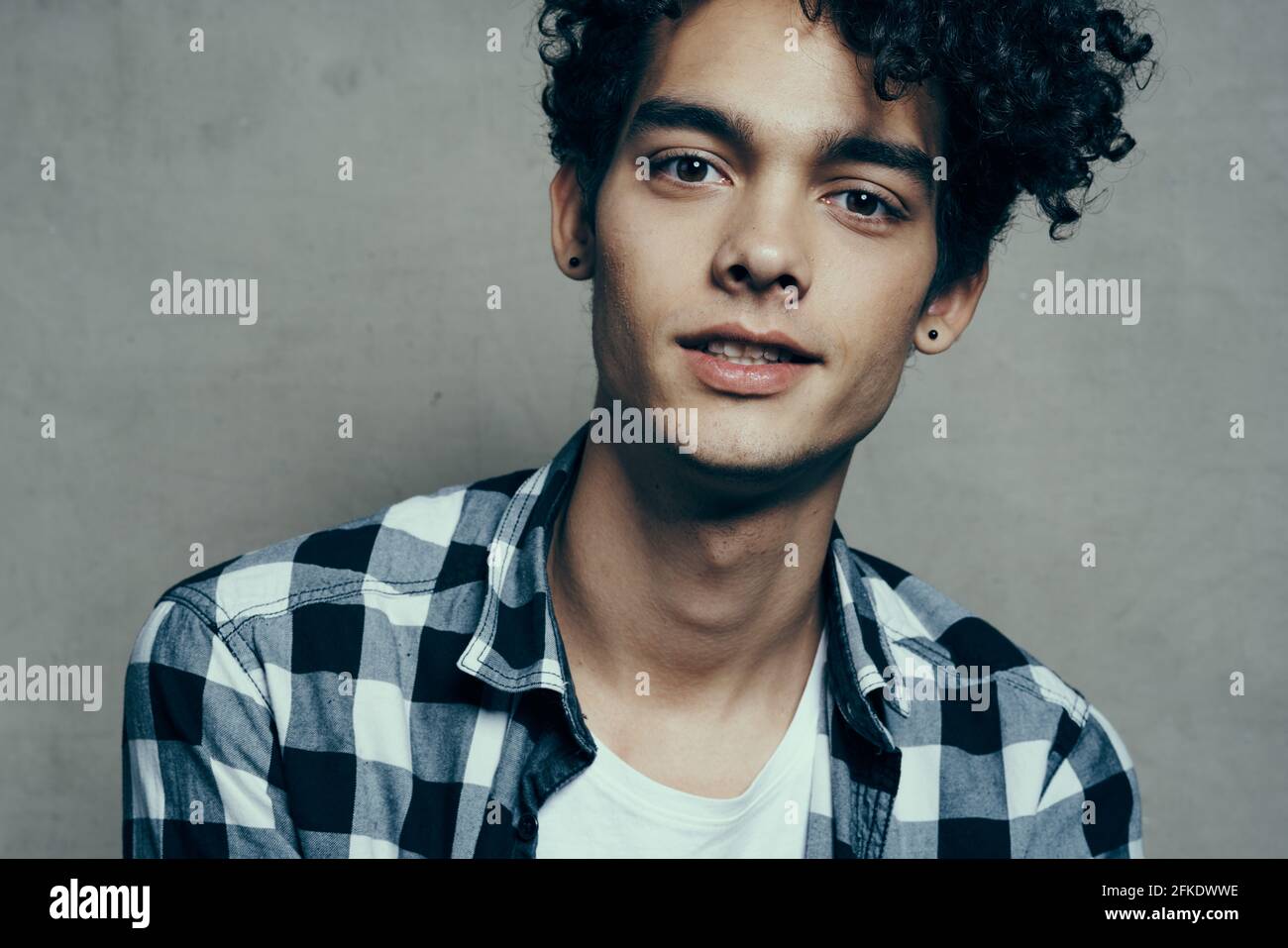 cute guy number shirt fun hair curly hair close up Stock Photo - Alamy