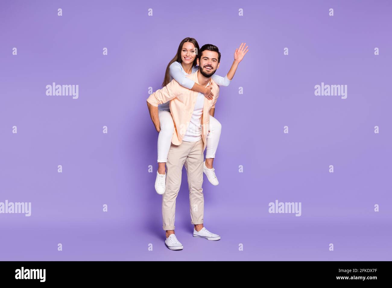 Full body profile portrait of nice cheerful guy lady piggyback arm palm ...