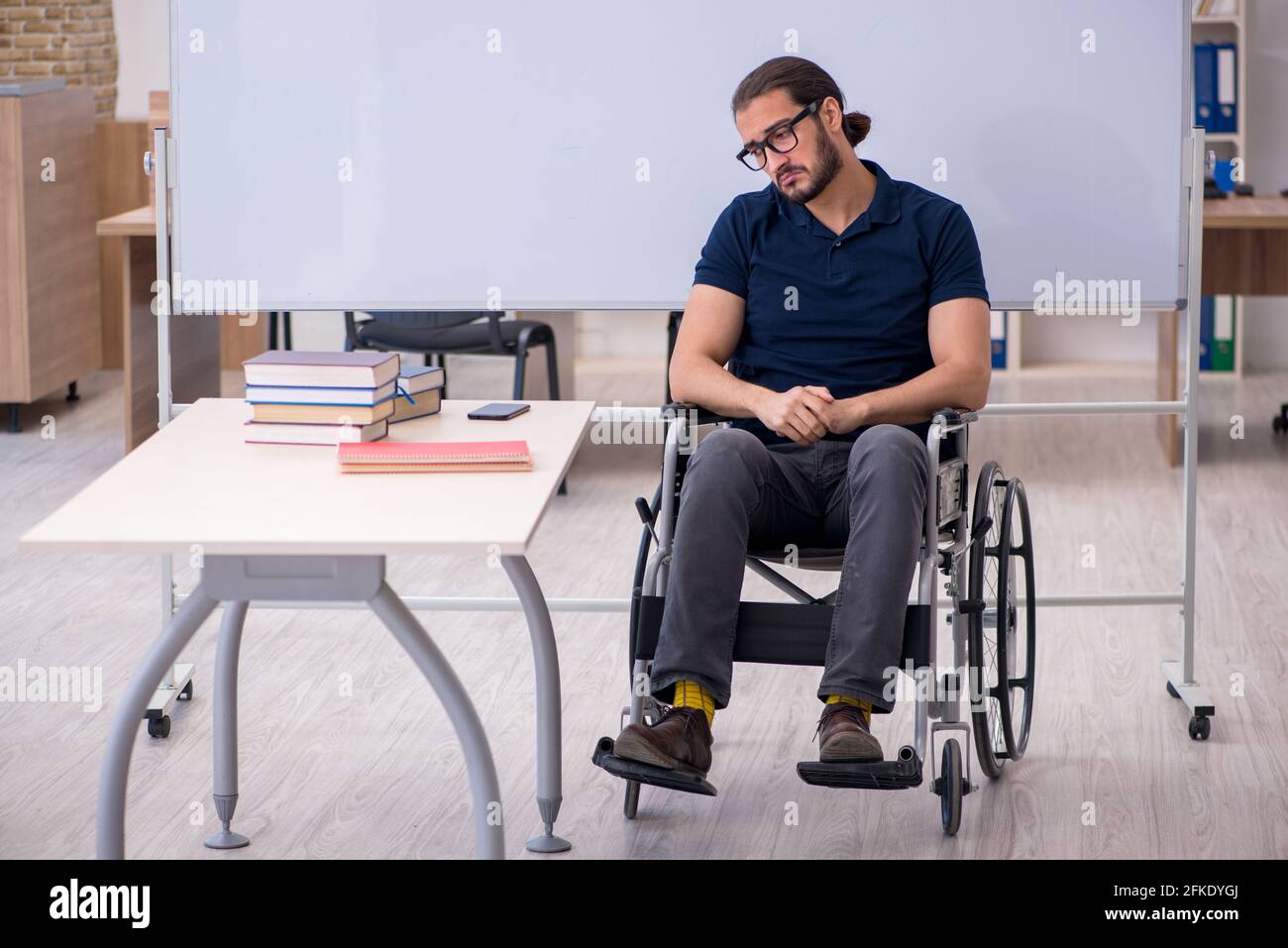 Young handicapped student in the classroom Stock Photo - Alamy