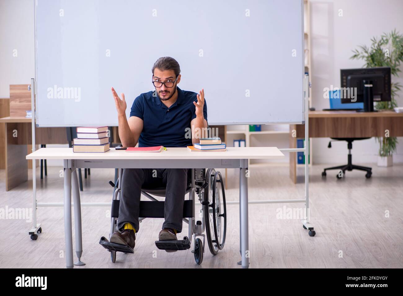 Young handicapped student in the classroom Stock Photo - Alamy