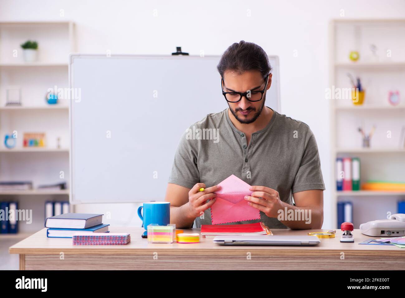 Young designer working in the office Stock Photo - Alamy