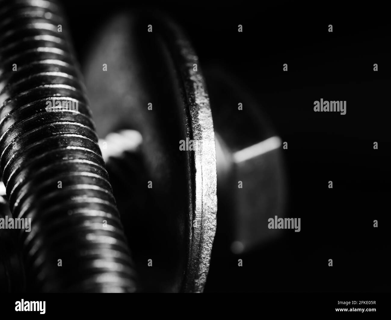Studio grayscale of screw on black background Stock Photo - Alamy