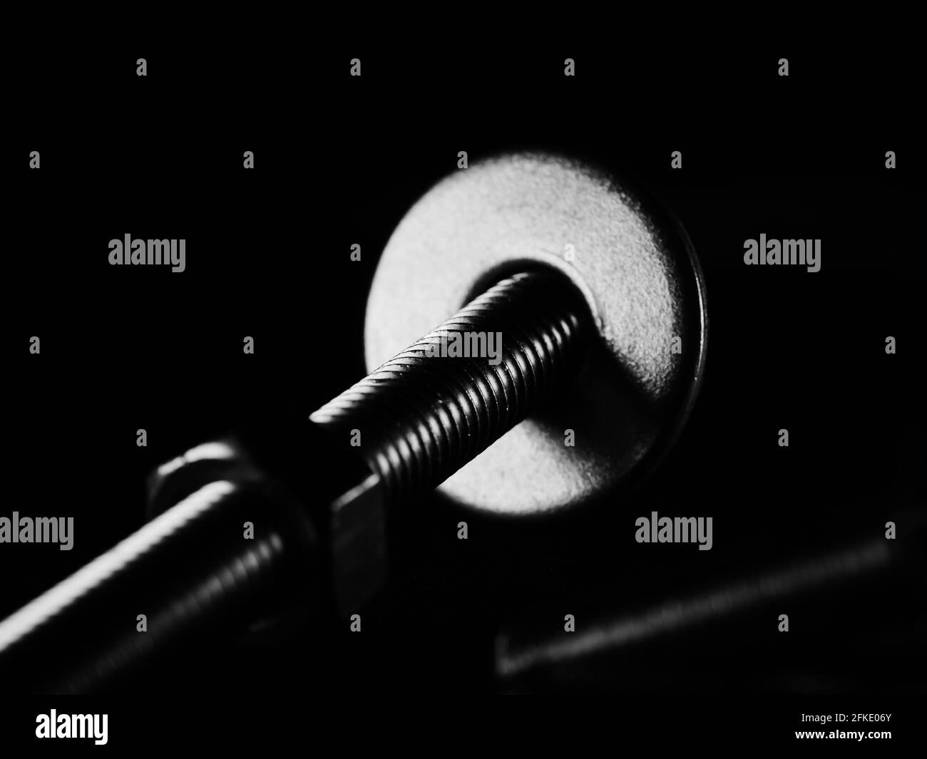 Studio grayscale of screw on black background Stock Photo - Alamy
