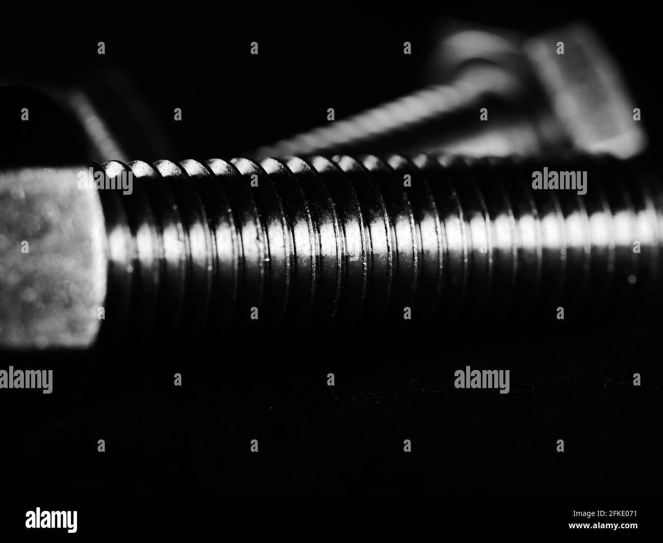 Studio grayscale of screw on black background Stock Photo - Alamy