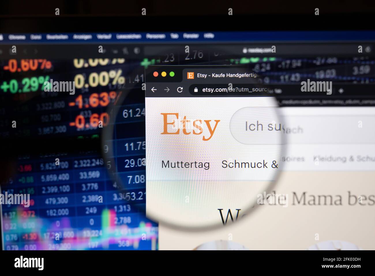 Etsy company logo on a website with blurry stock market developments in ...