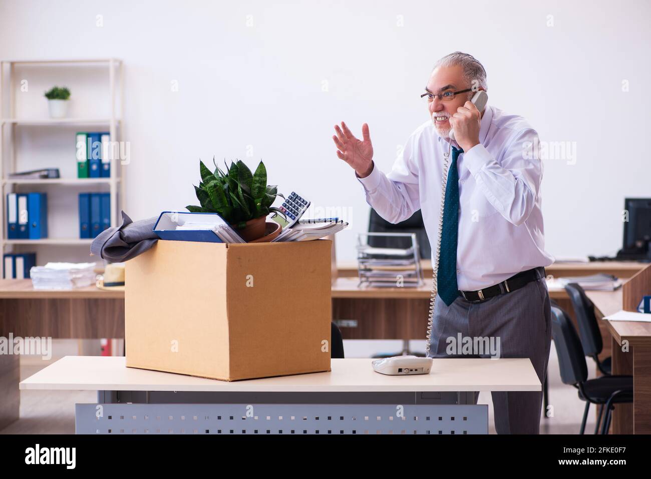 Old employee being fired from his work Stock Photo - Alamy